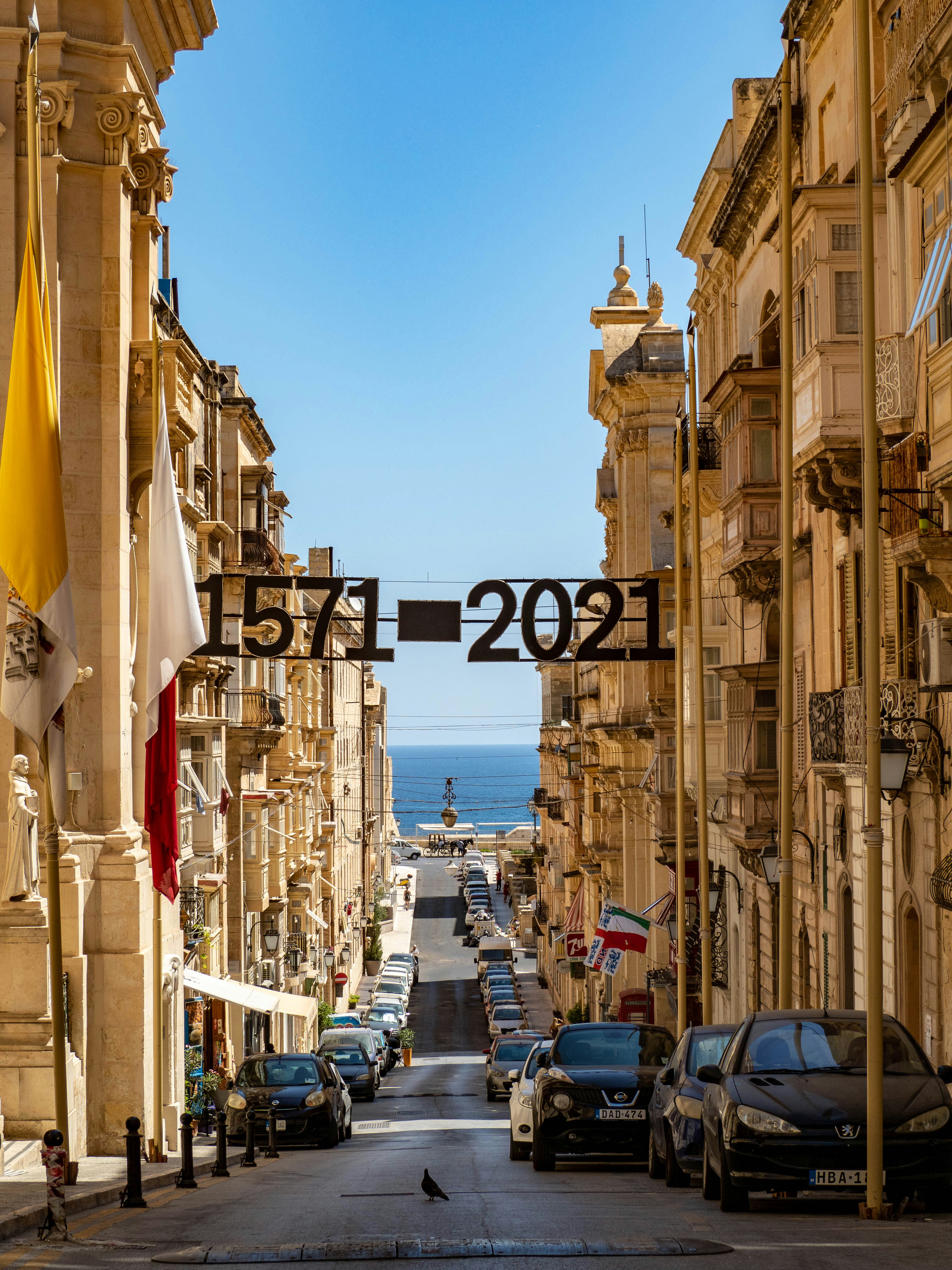Anniversary Arch Over a Maltese Avenue Gazing Toward the Sea