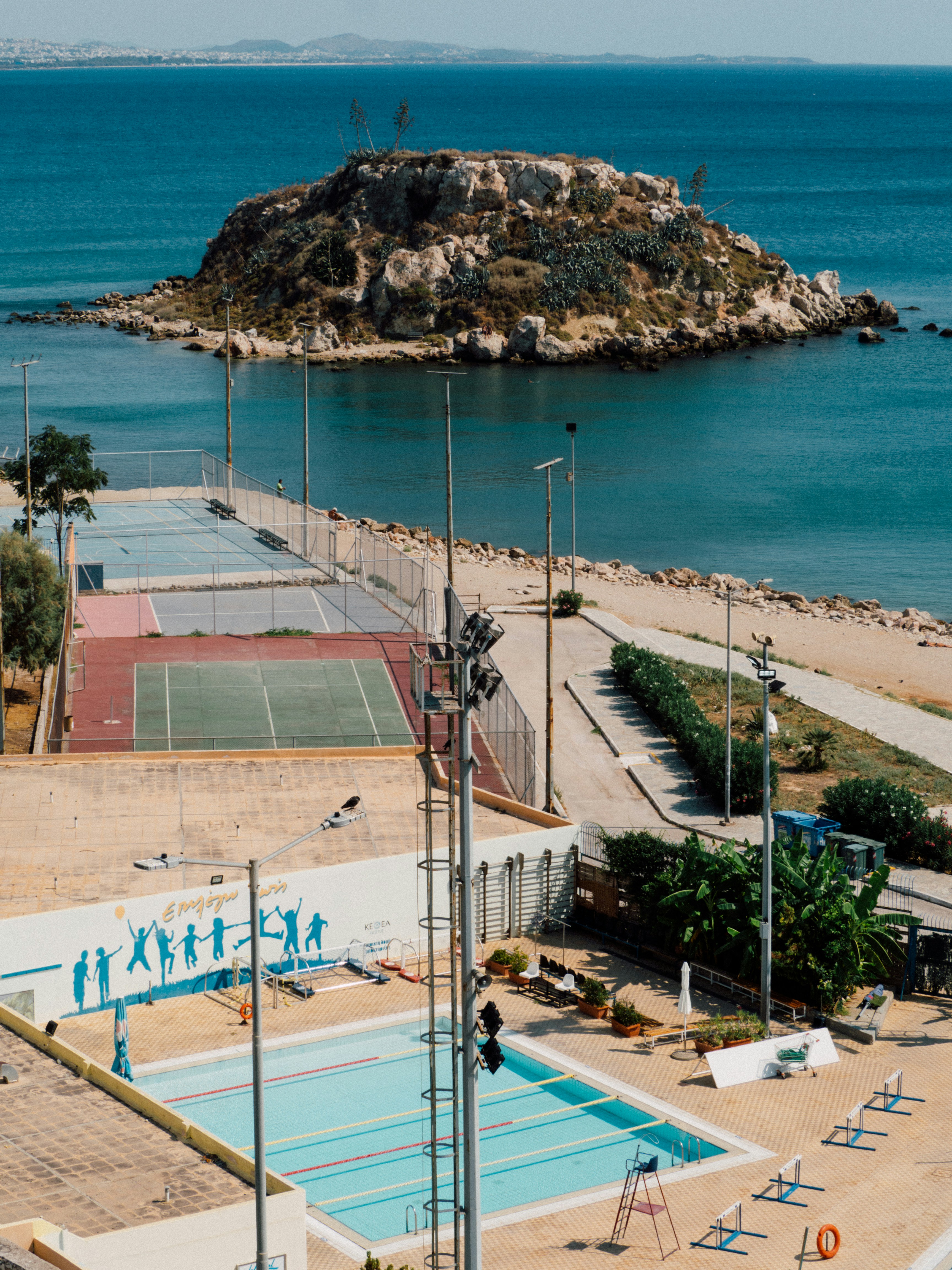 Rocky Islet Horizon Over a Seaside Sports Complex