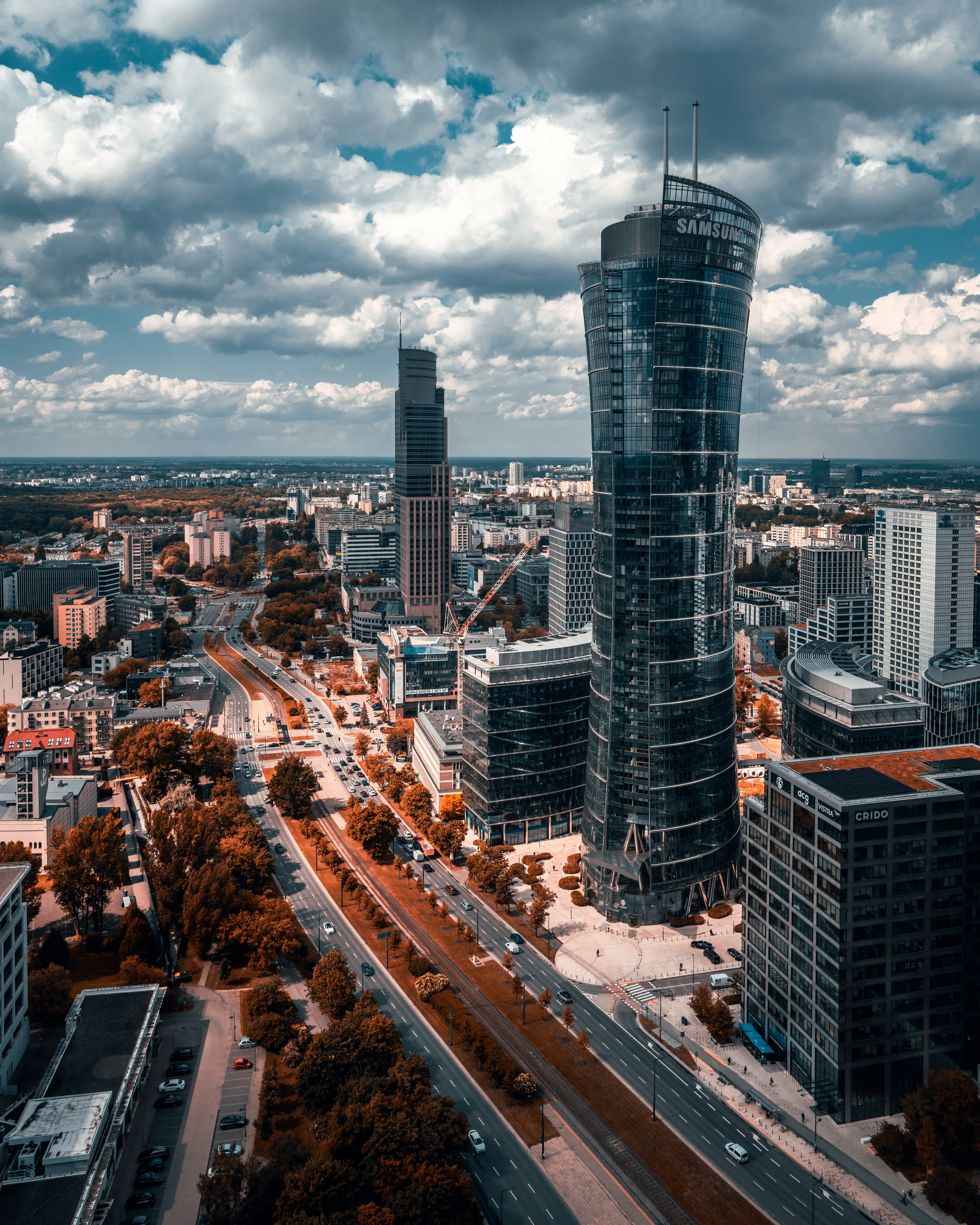 Samsung Tower Ascendant: A glass-clad megacity under a dramatic cloudscape