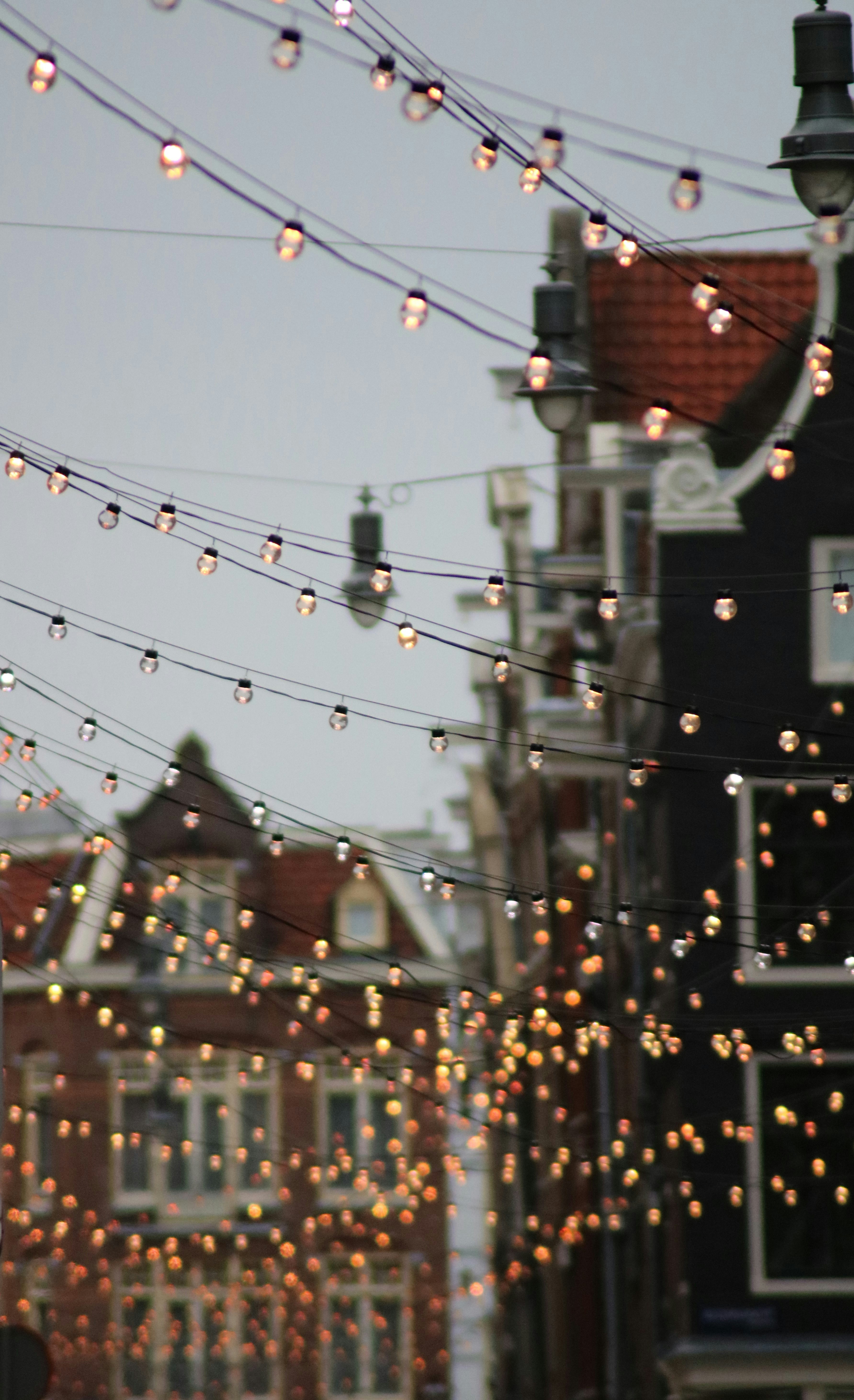Evening Glow above Canal Street — string lights in a narrow Dutch-inspired street