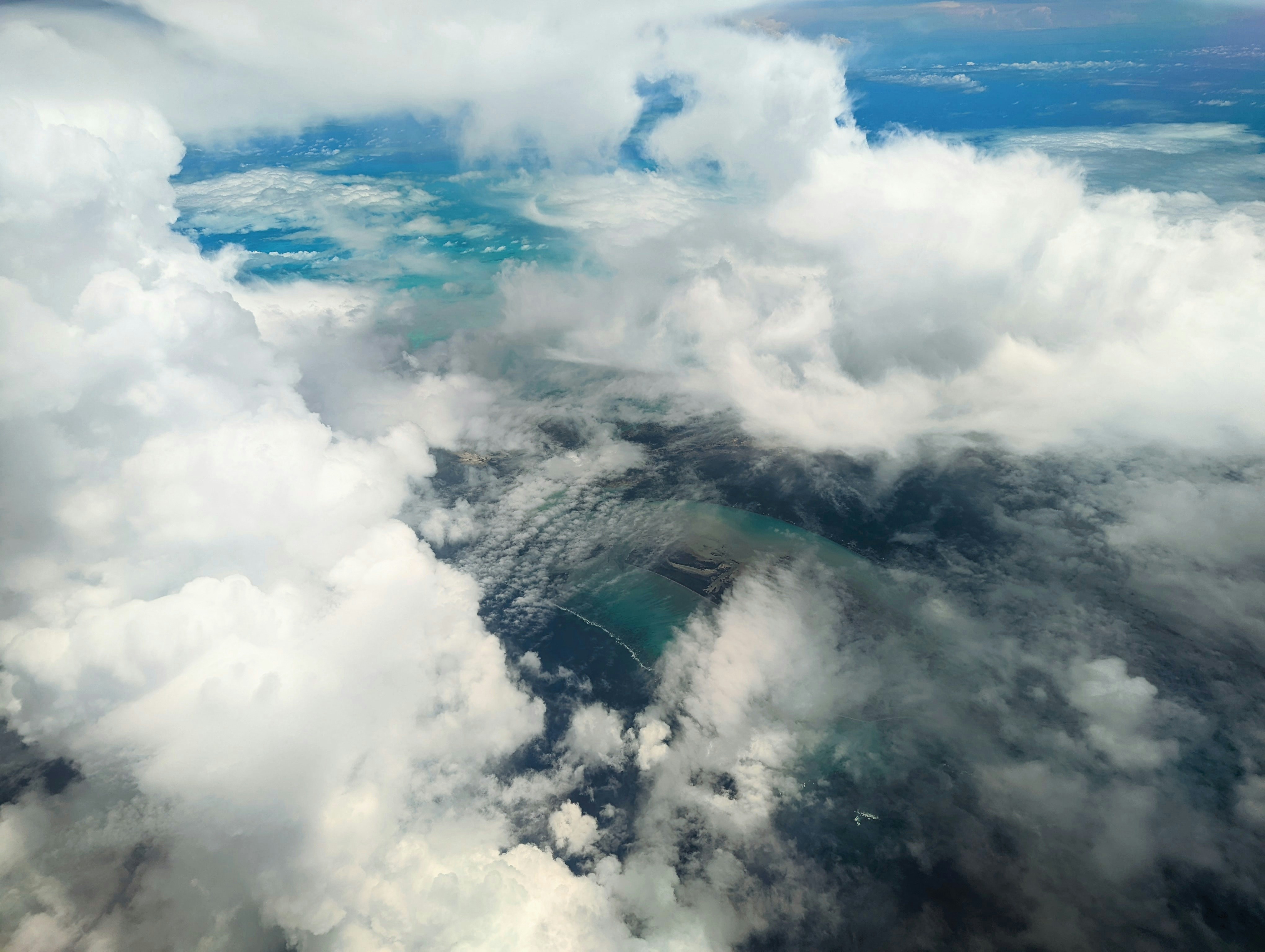 A view of the Caribbeans and some clouds from the air.