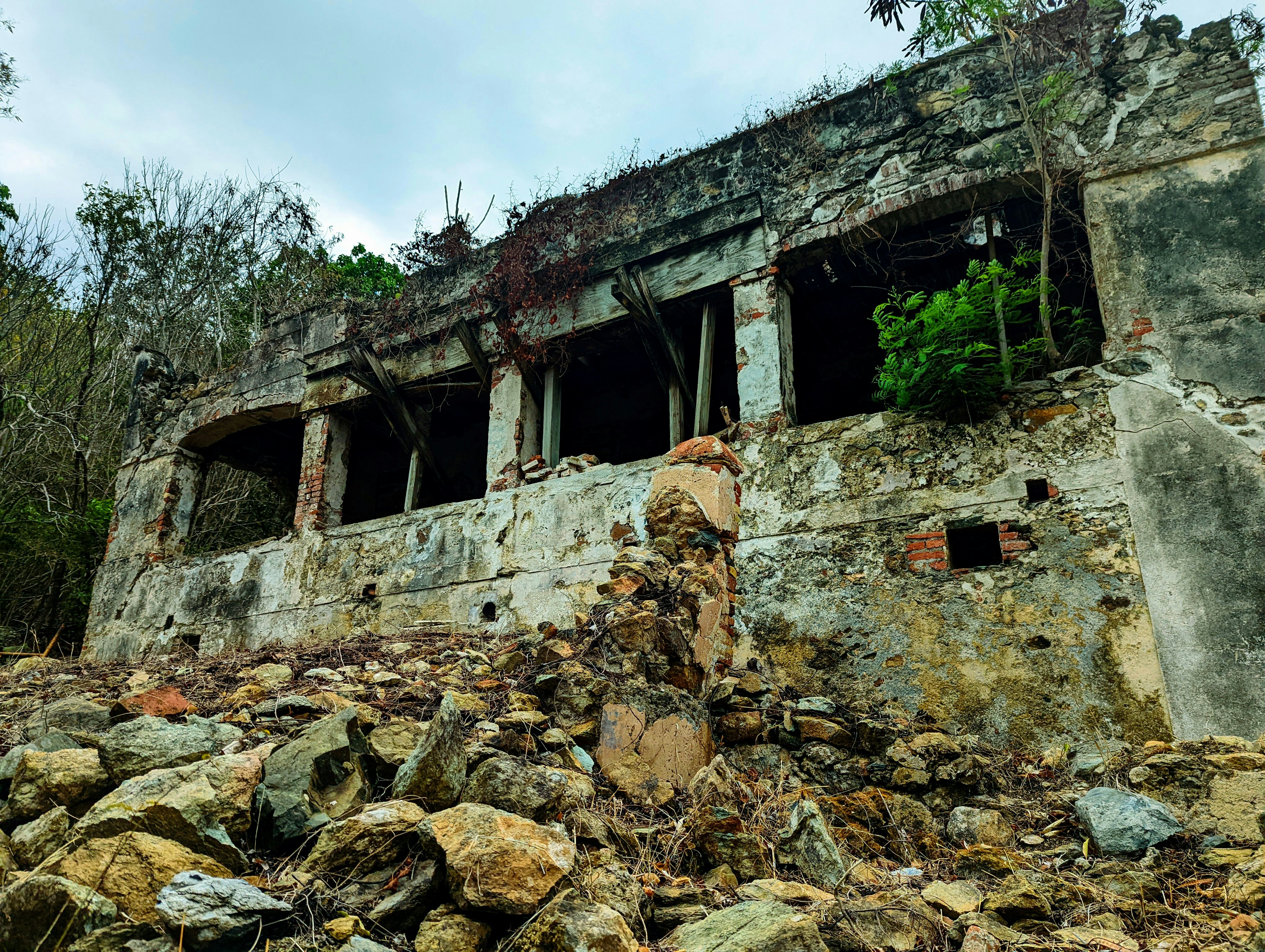 Overgrown Echoes: A Crumbling Barracks Reclaimed by Time