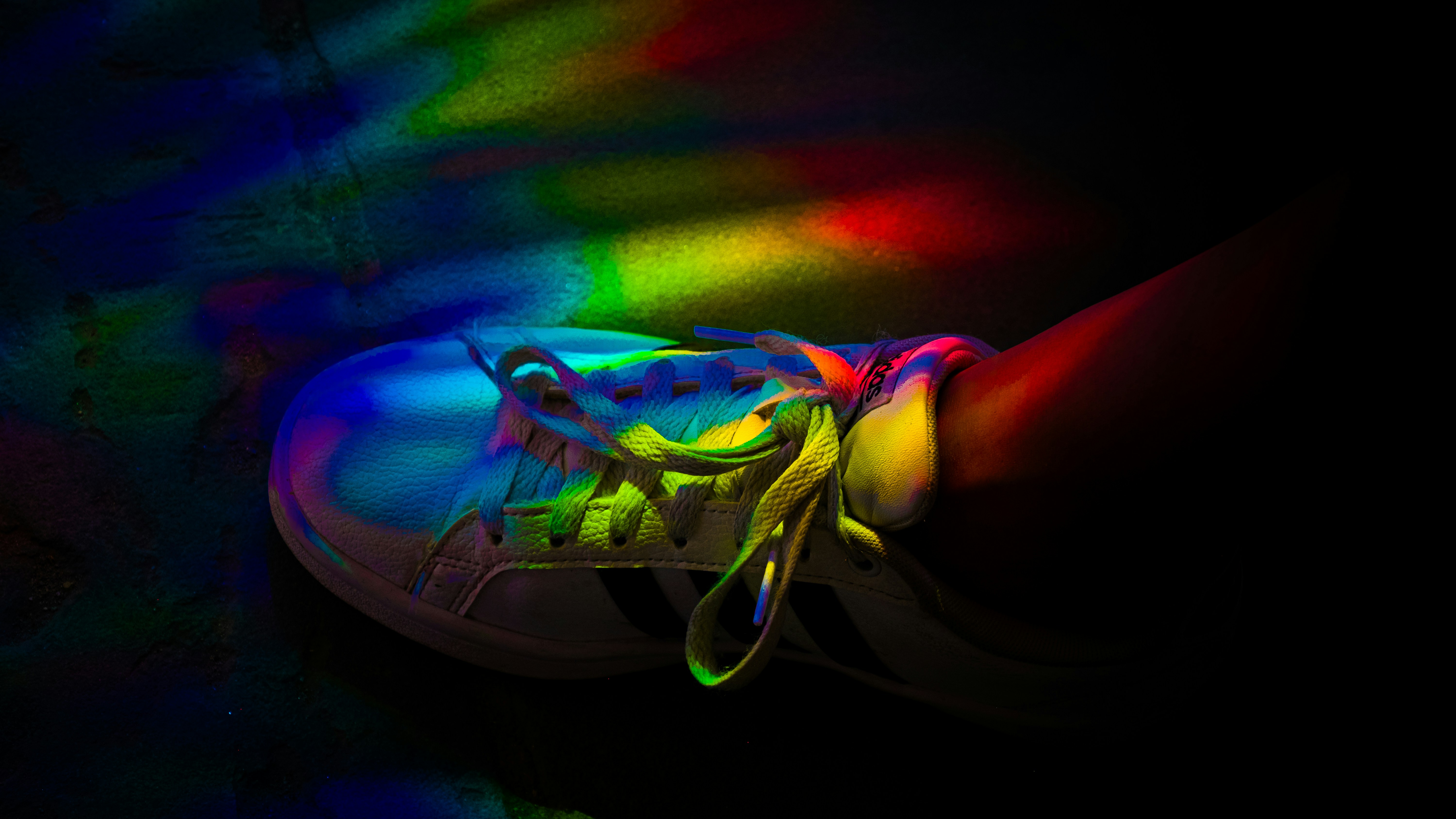 Prismatic Stride: Neon Reflections on a Silent Sneaker