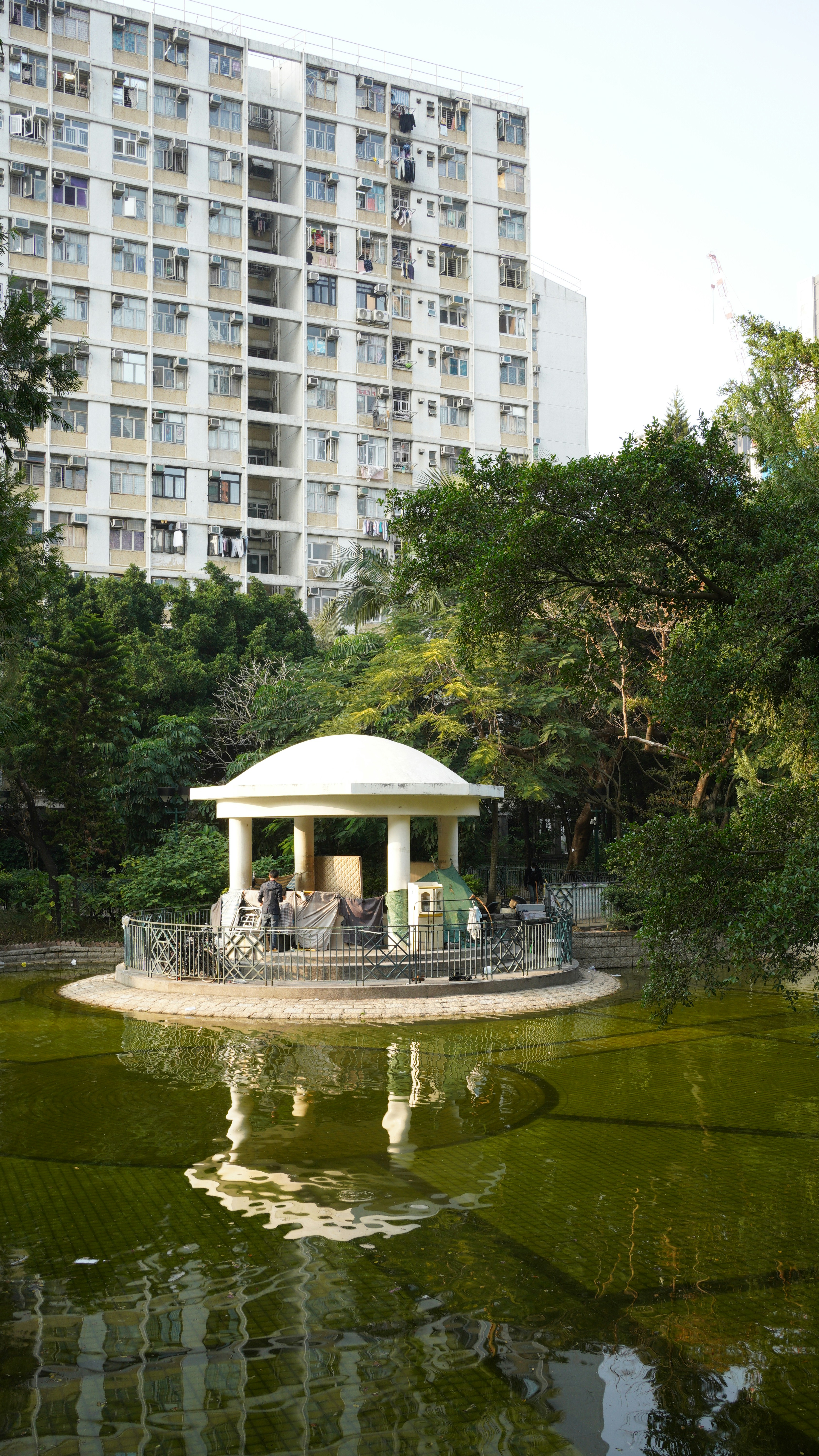 a building with a pool in front of it