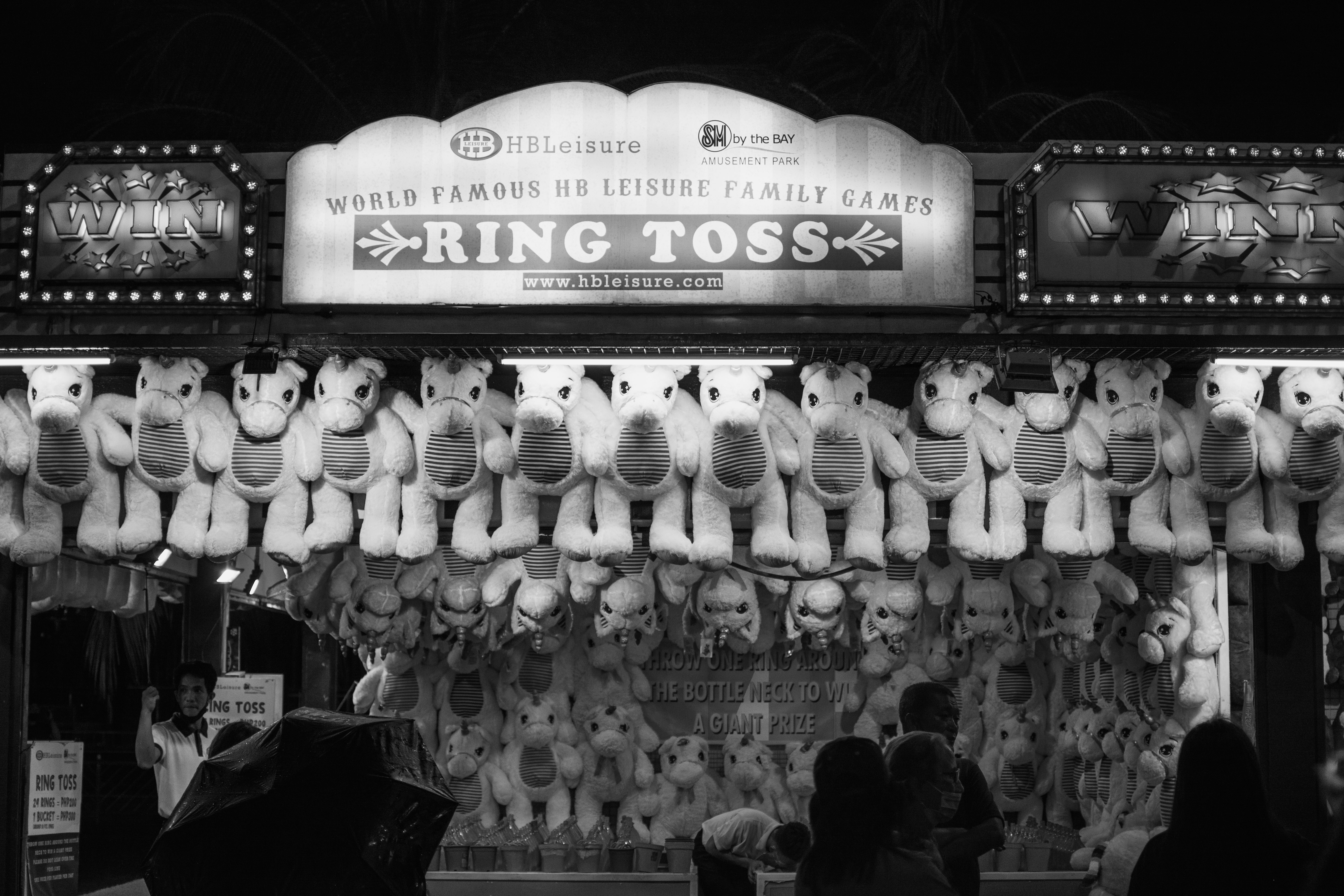 Ring Toss: Plush Parade Under Neon Spotlight