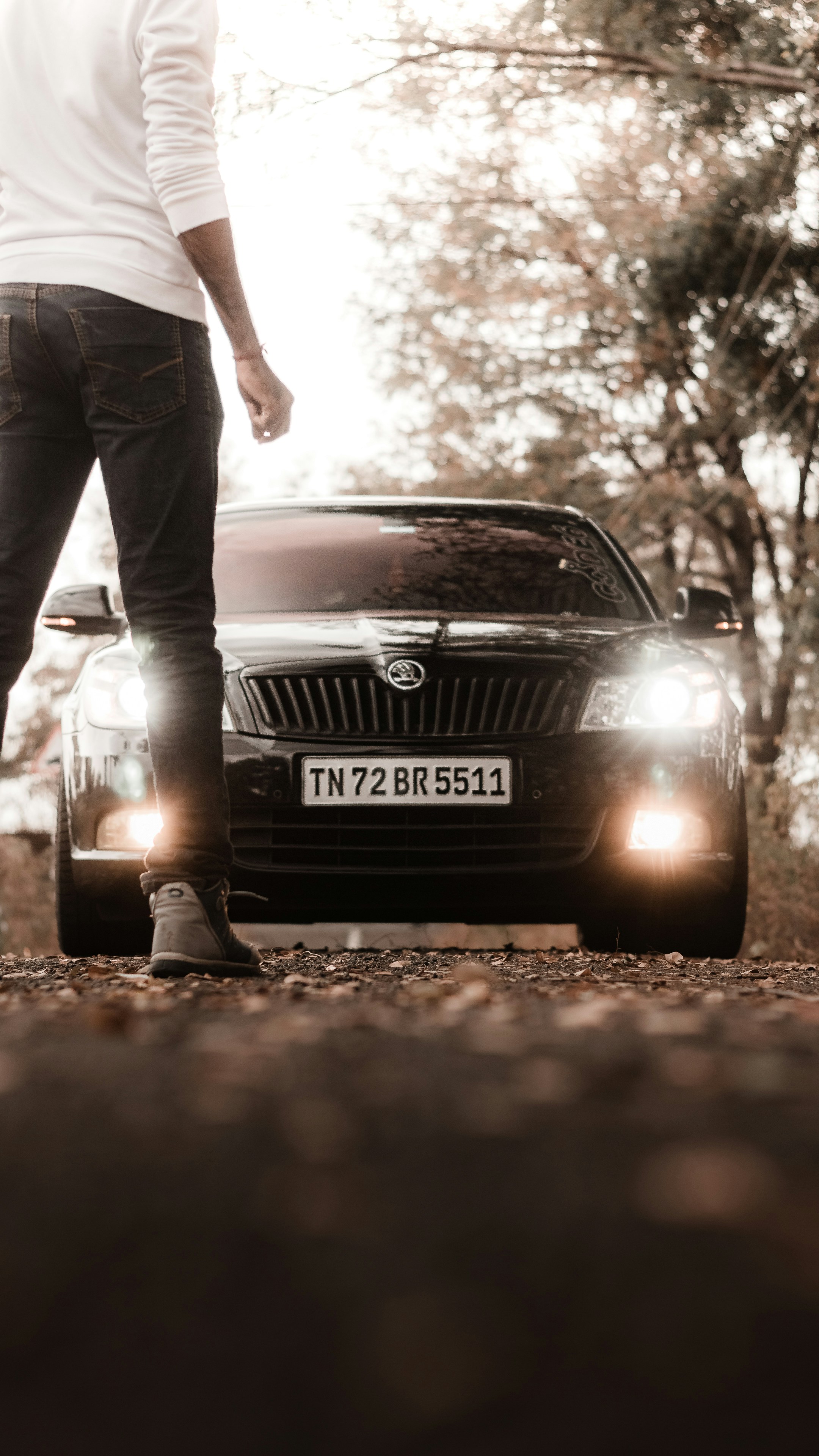 Approaching Night Drive: A Car, a Man, and a Quiet Road
