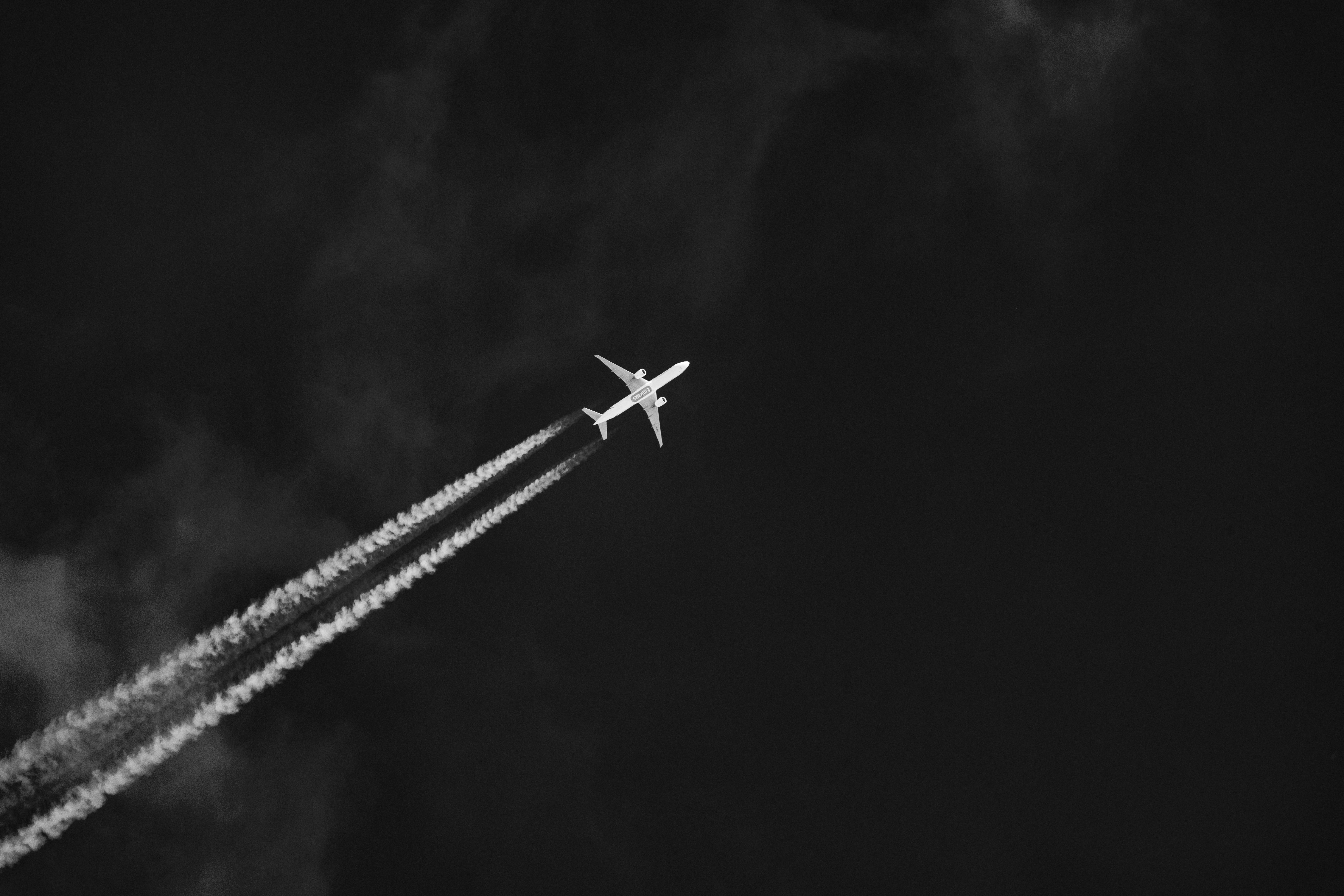 Contrail Arrow: A Jet's White Wake Across a Velvet Sky