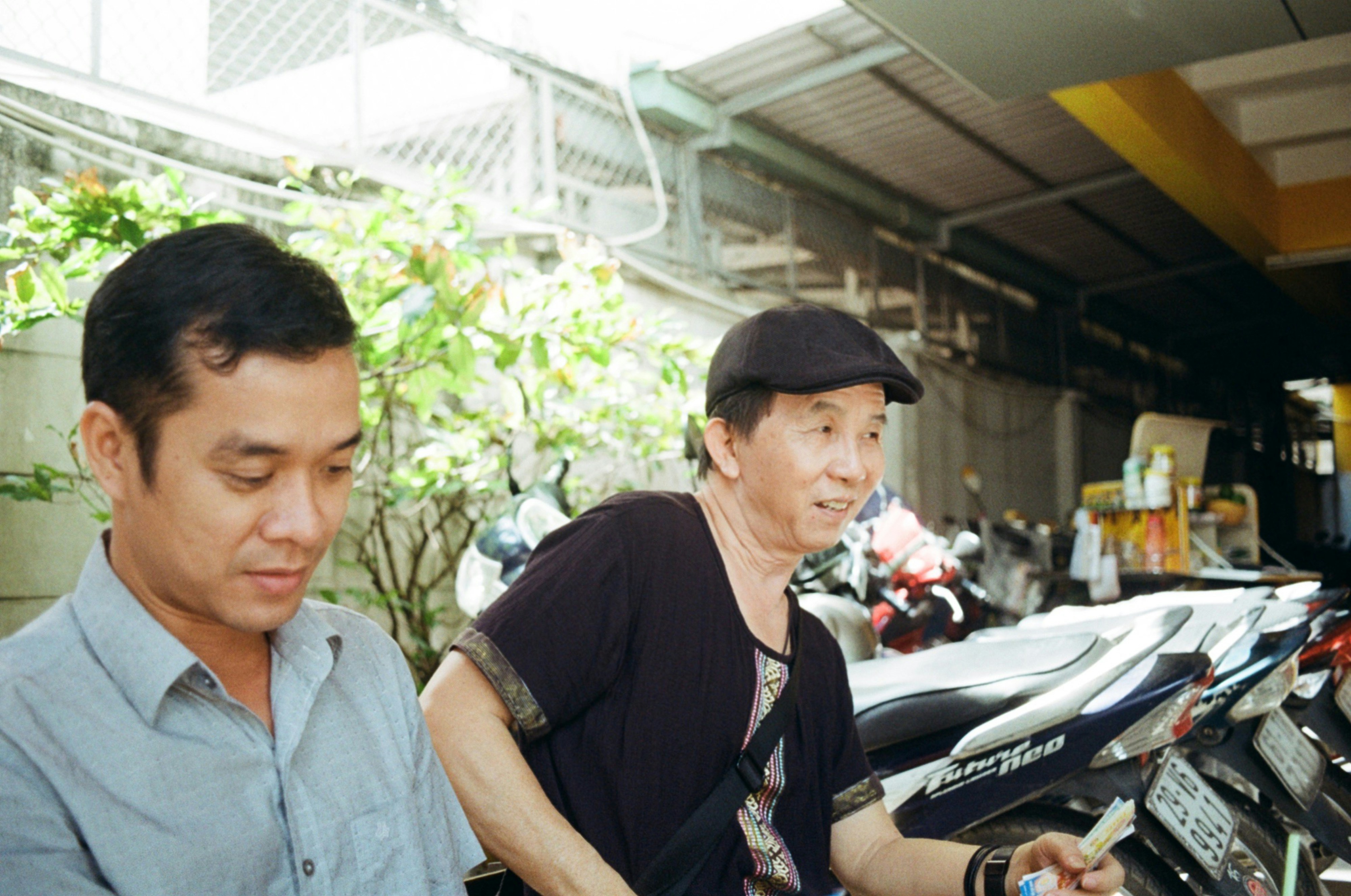 A couple of men looking at a motorcycle photo – Free Car Image on Unsplash