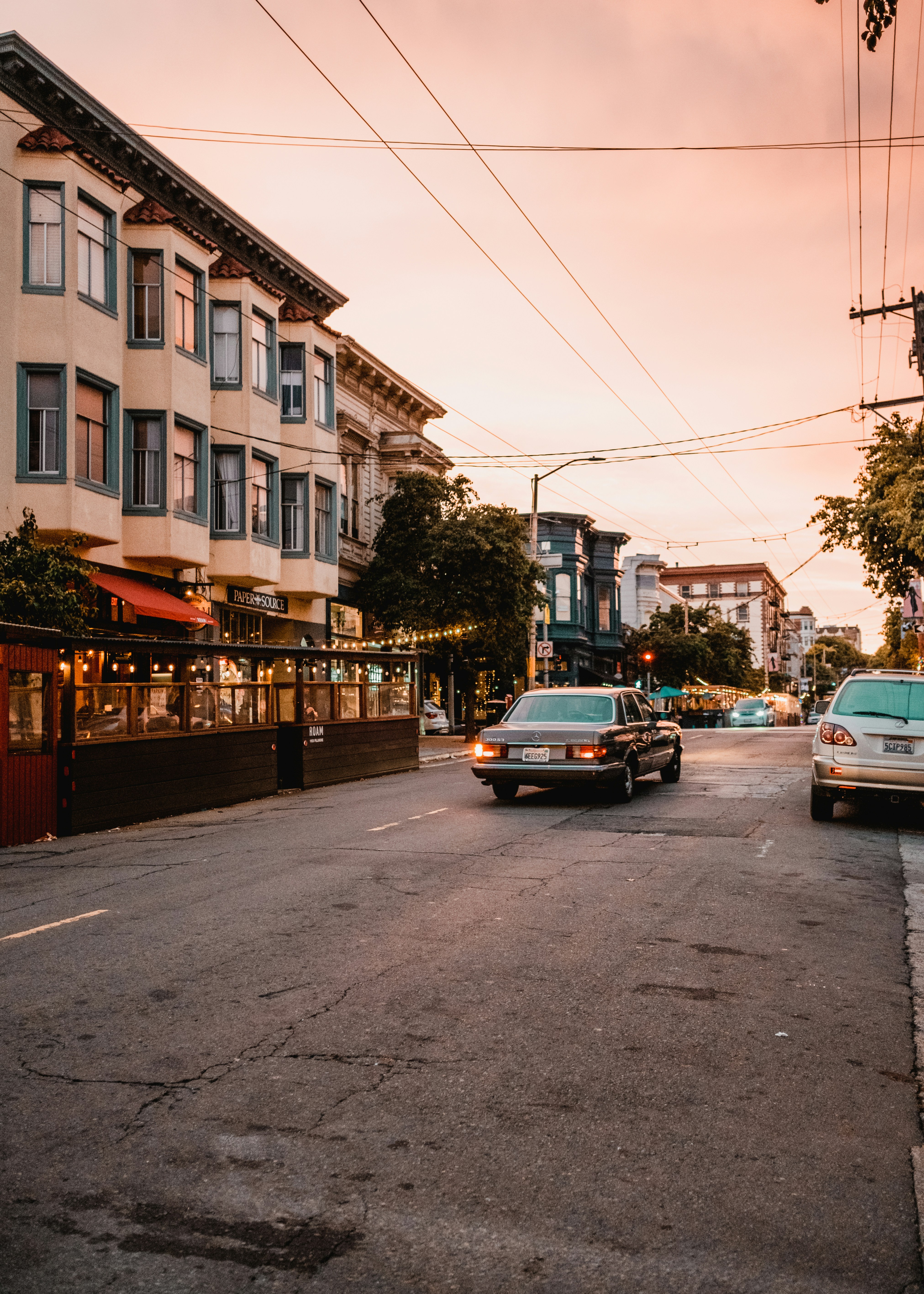 Sunset Street: Cars, Warm Light, and a Quiet Urban Canyon