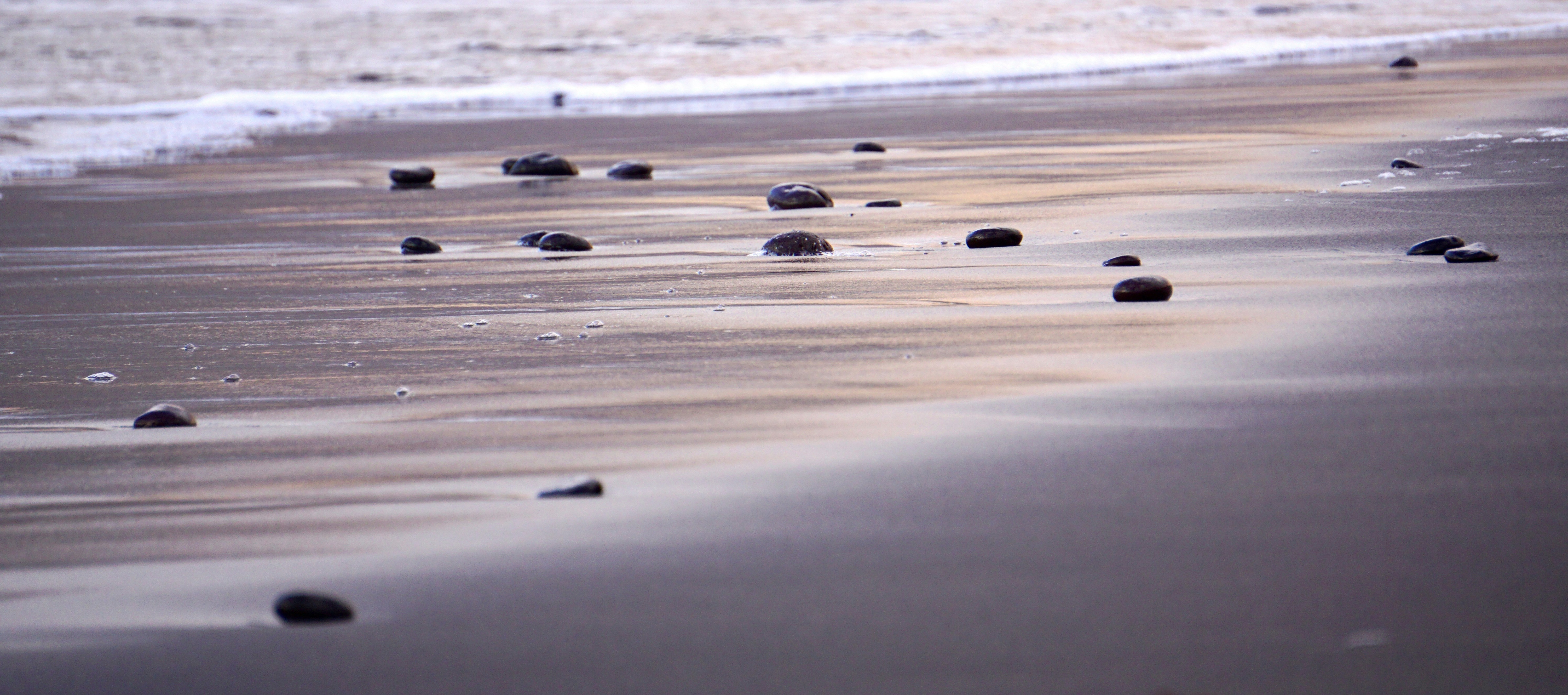 Pebble Breadcrumbs on a Quiet Shore at Dusk