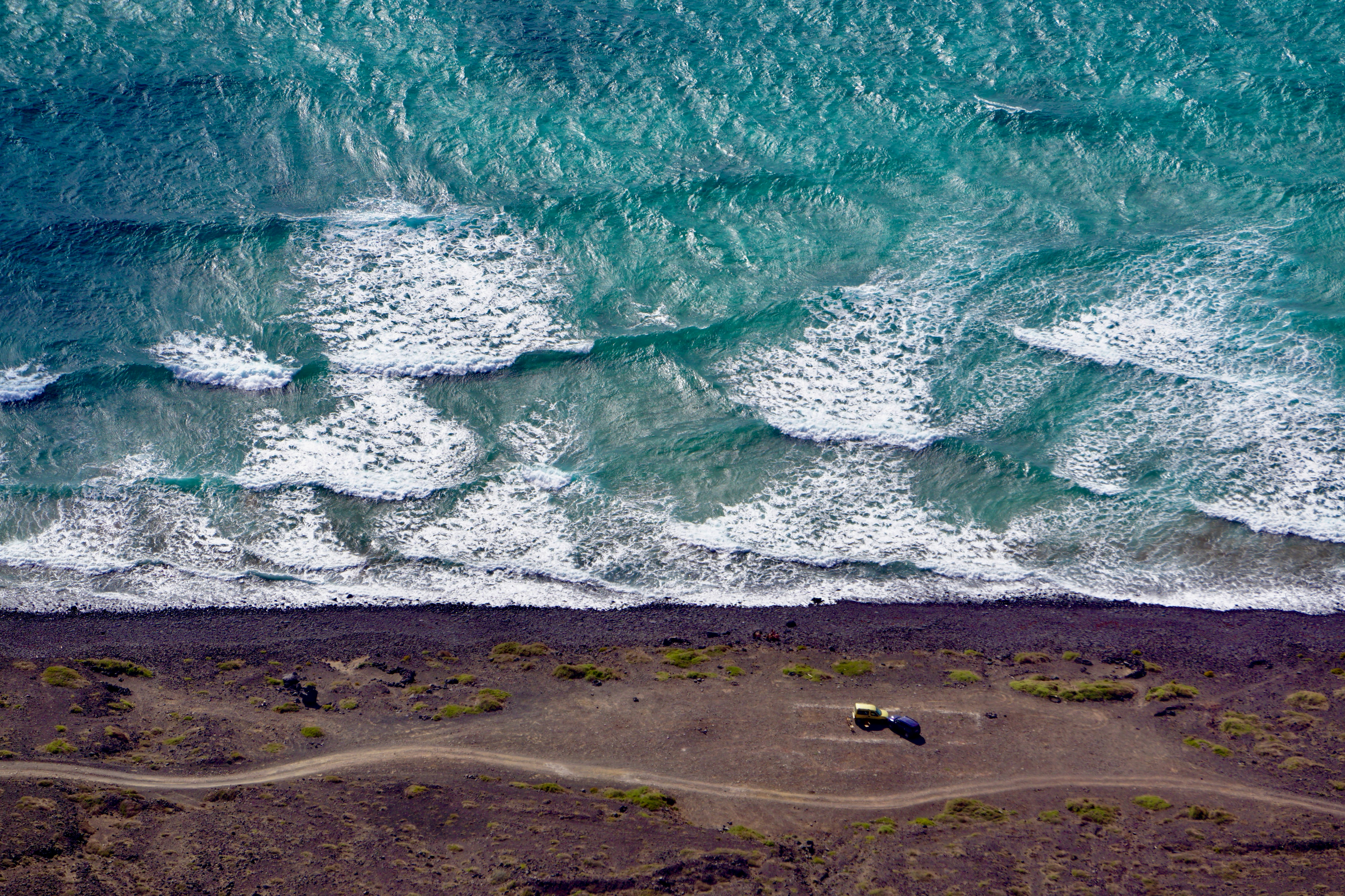 Foto zum Thema Ein Strand mit Wellen, die zusammenbrechen – Kostenloses ...