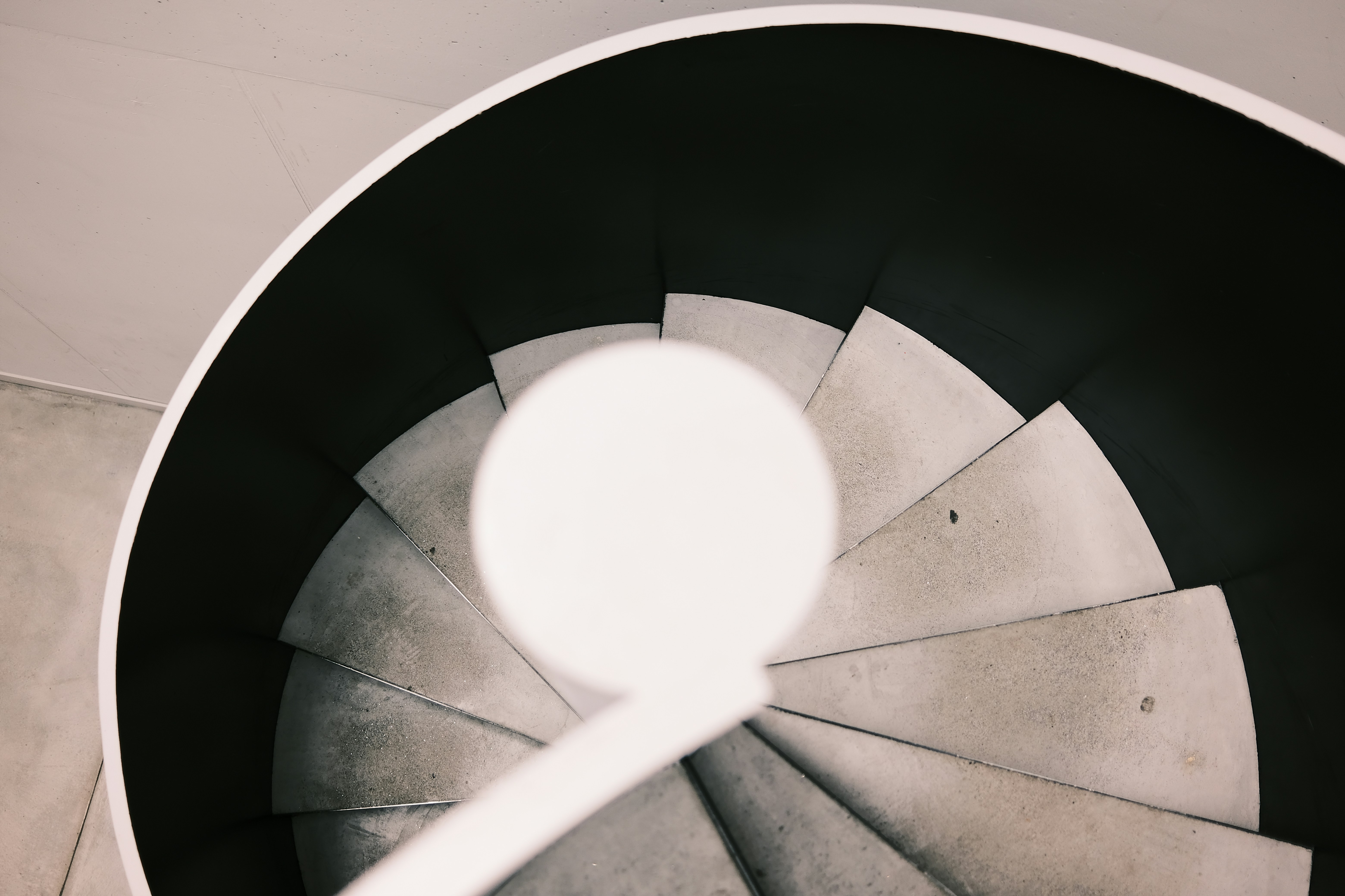 Spiral Staircase Spotlight: Center of a Blurred Balancing Act