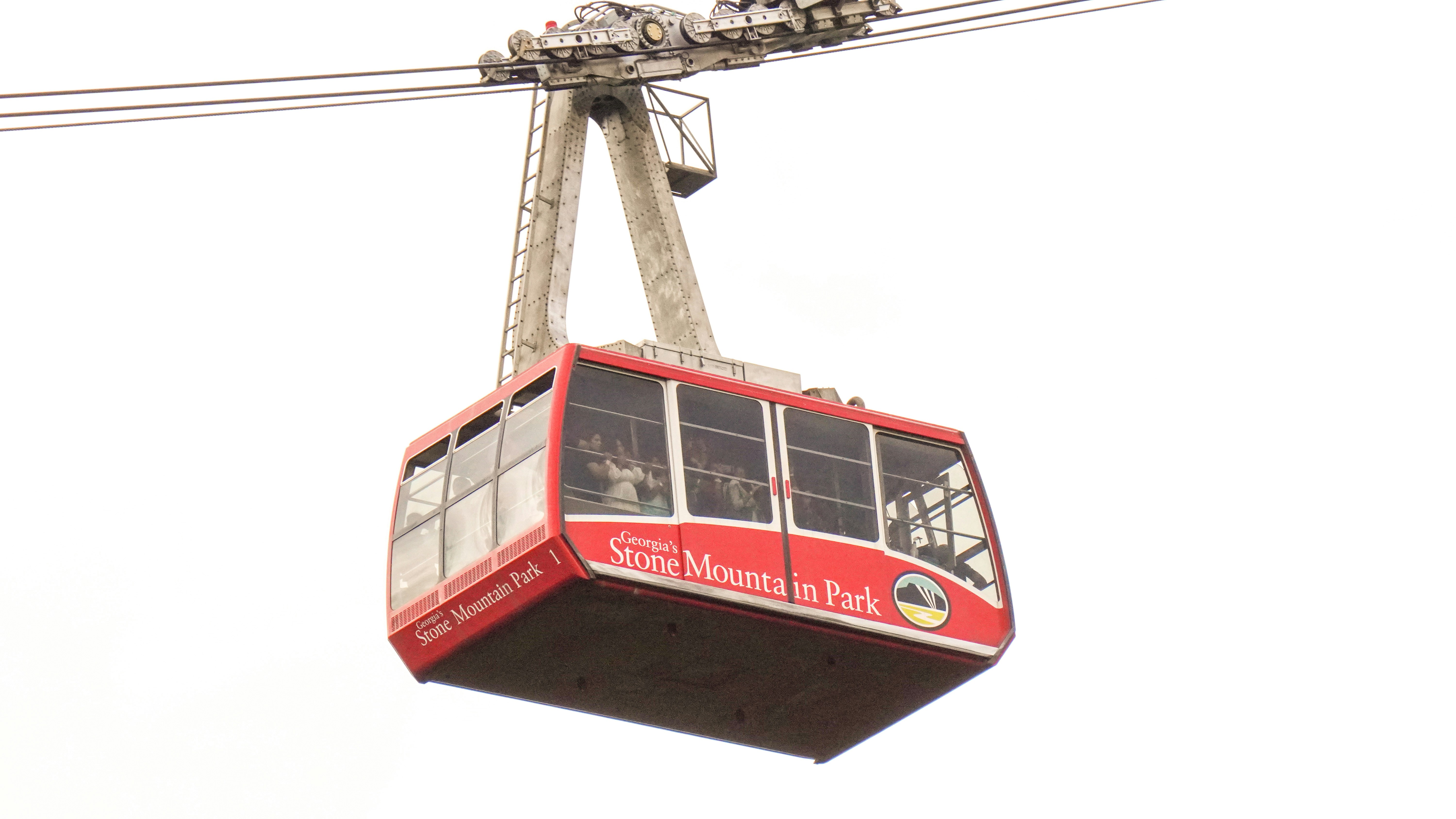 A red cable car photo – Free Stone mountain Image on Unsplash