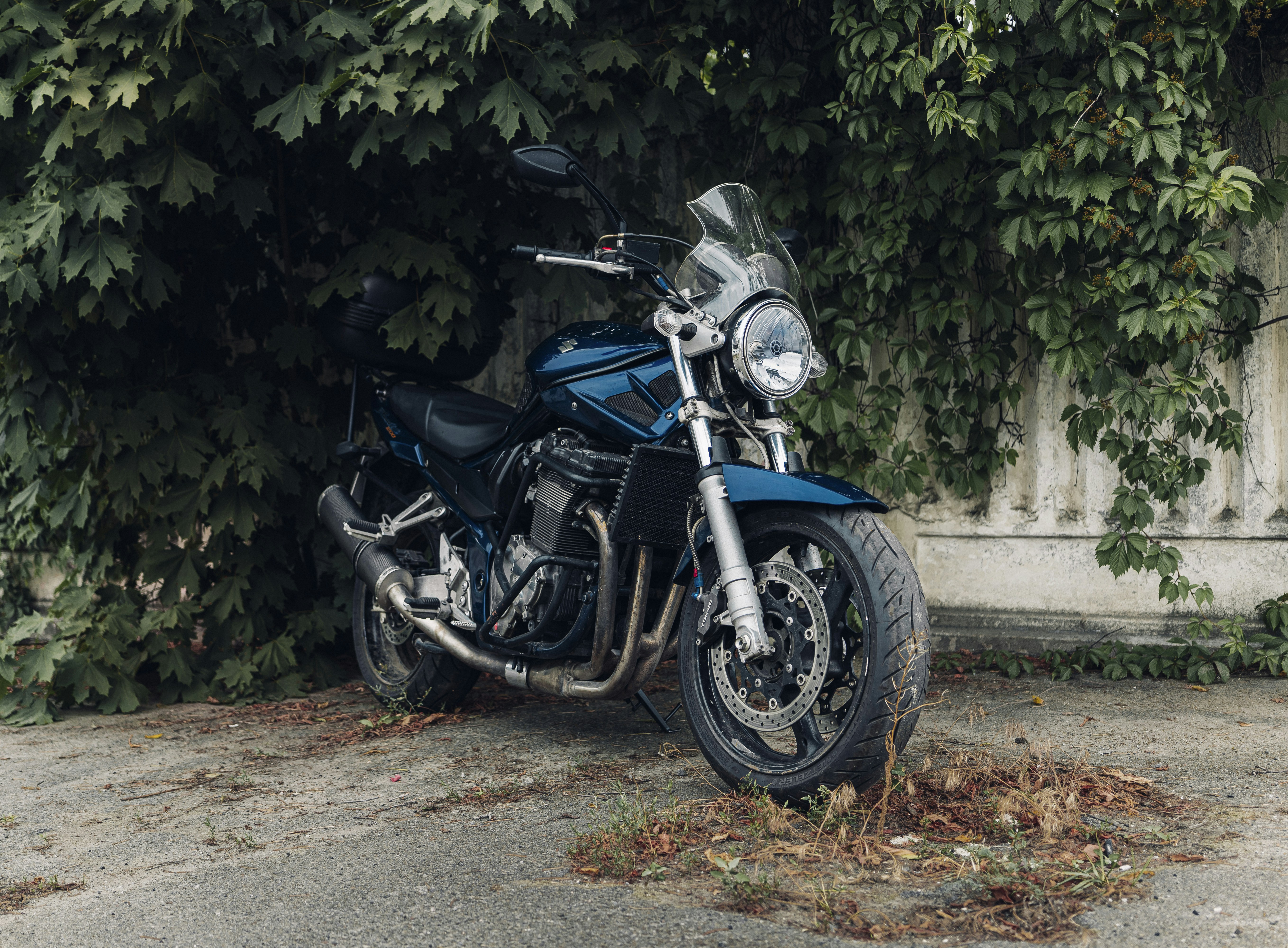 a motorcycle parked on the side of a roadMaksym Tymchyk 🇺🇦