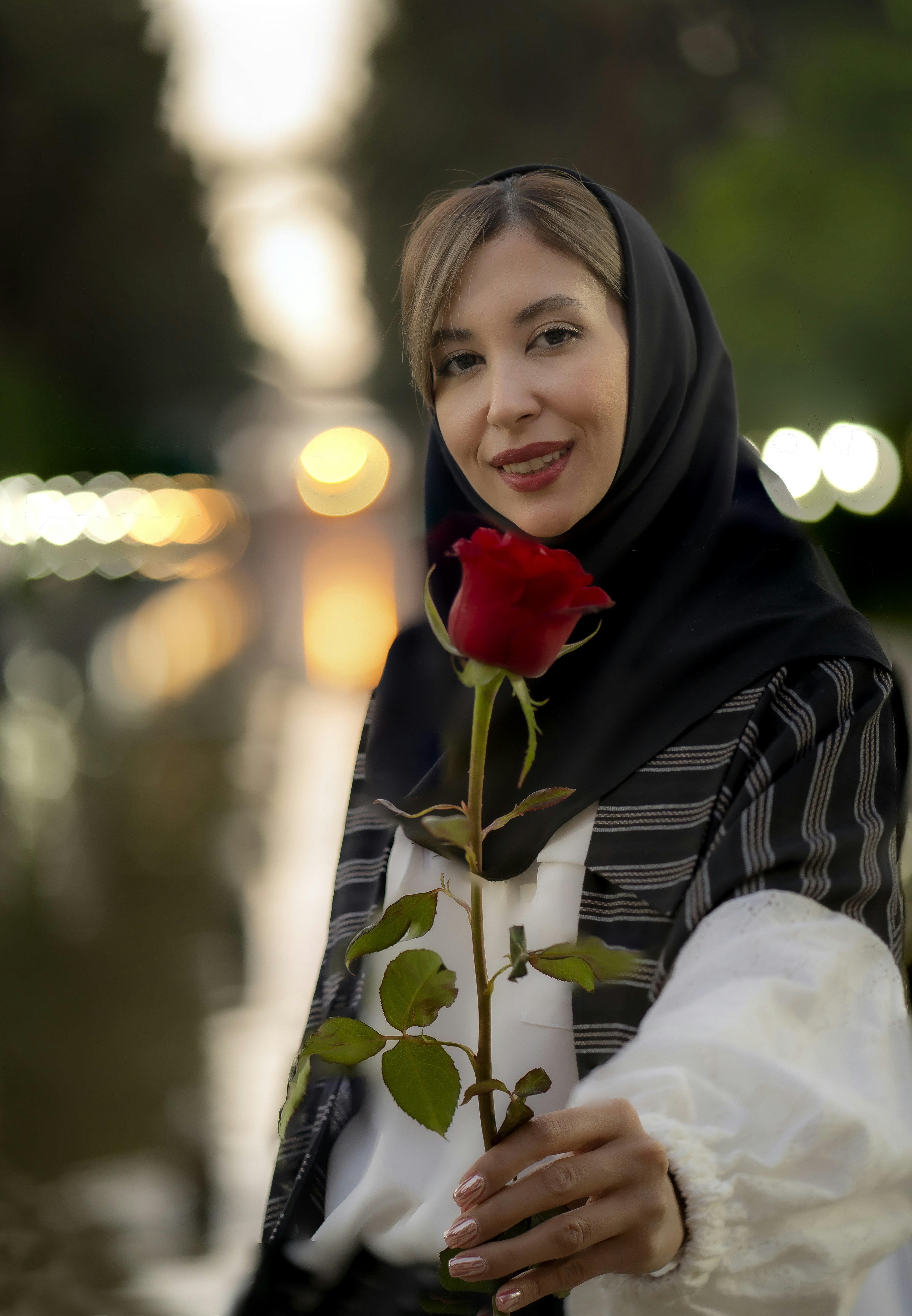 Crimson Rose Moment: Soft-Focus Portrait by Riverside Lights