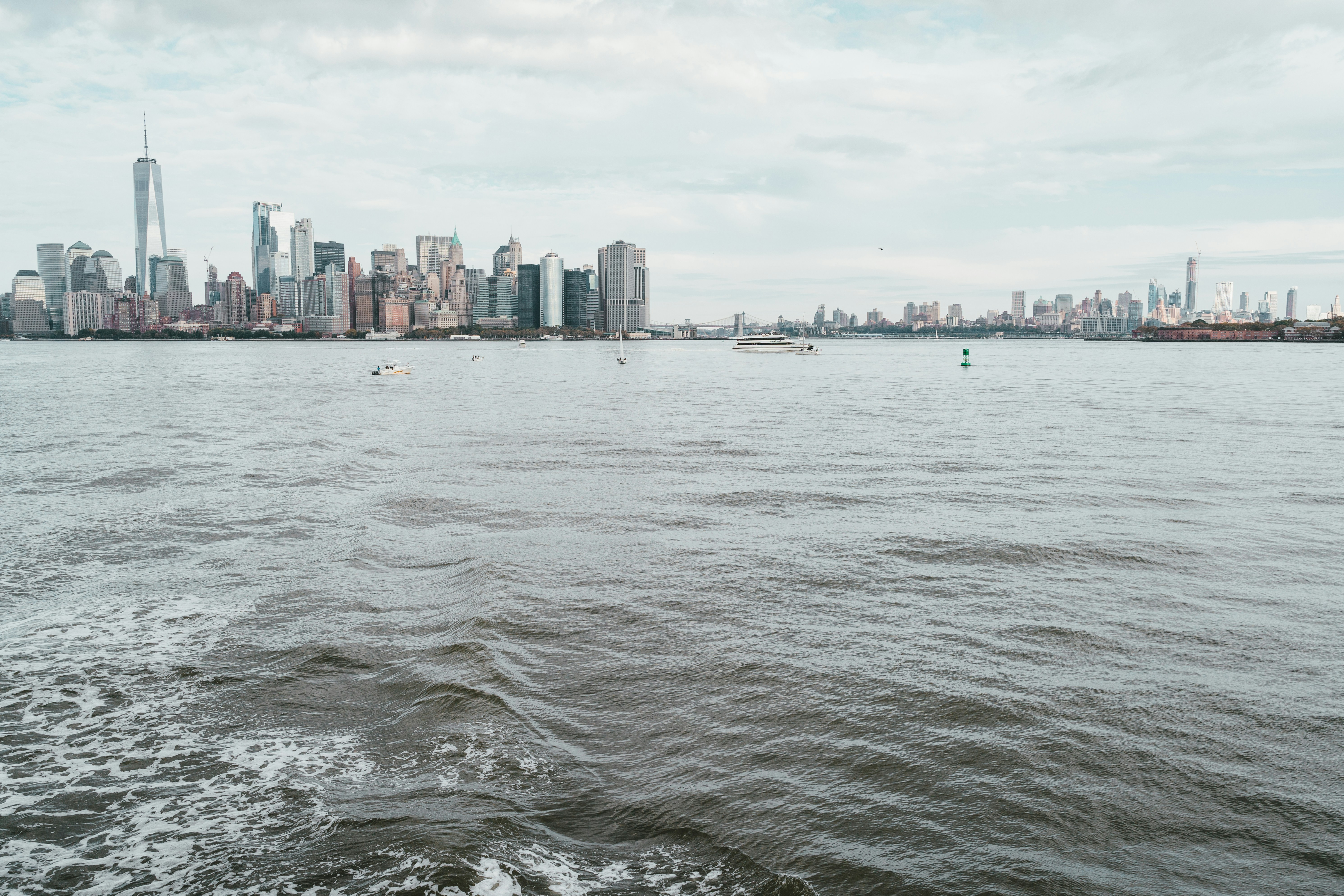 a body of water with a city in the background