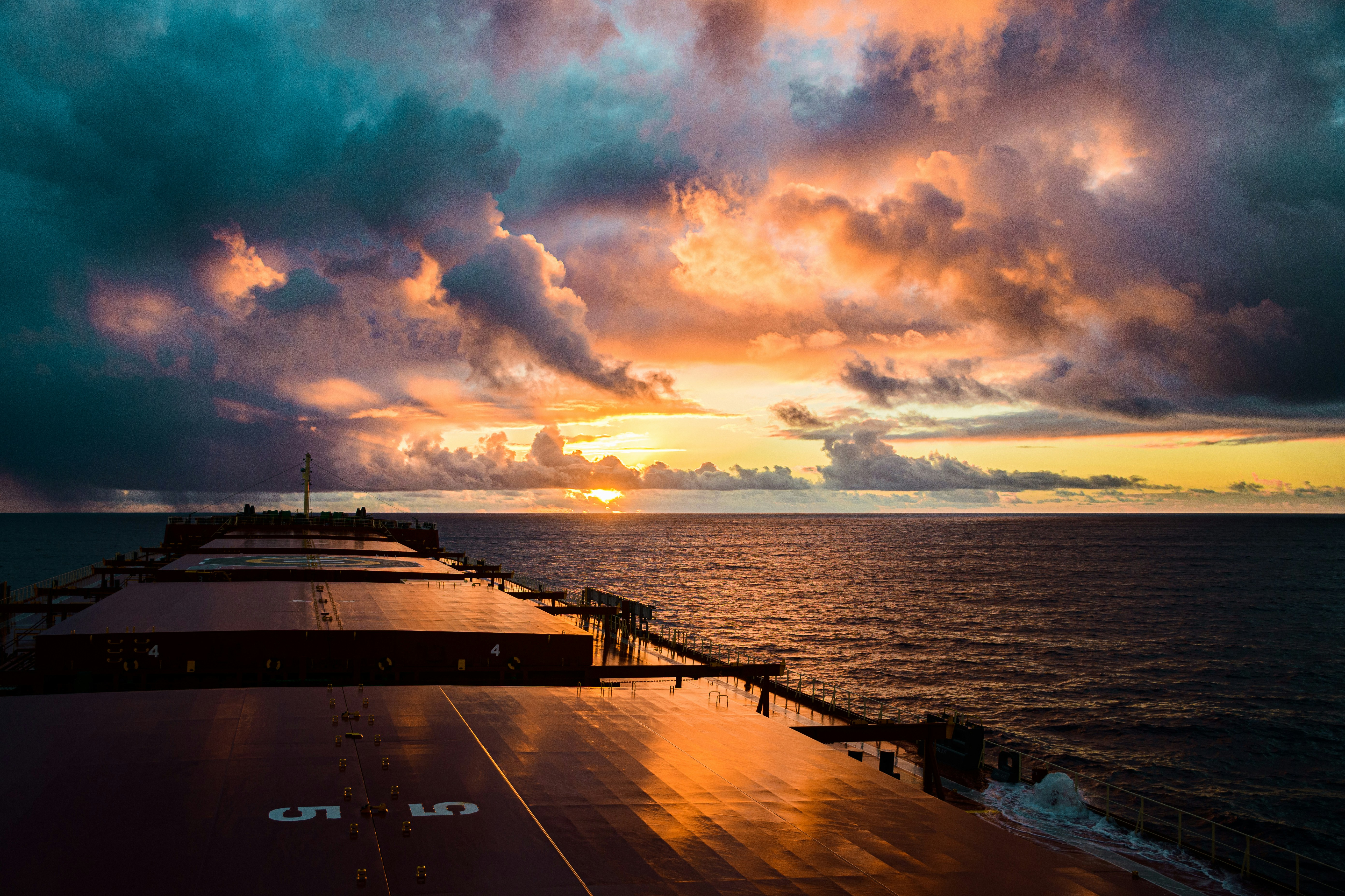 Sunset at the Pier's Edge: The Deck Reaches Toward a Molten Horizon