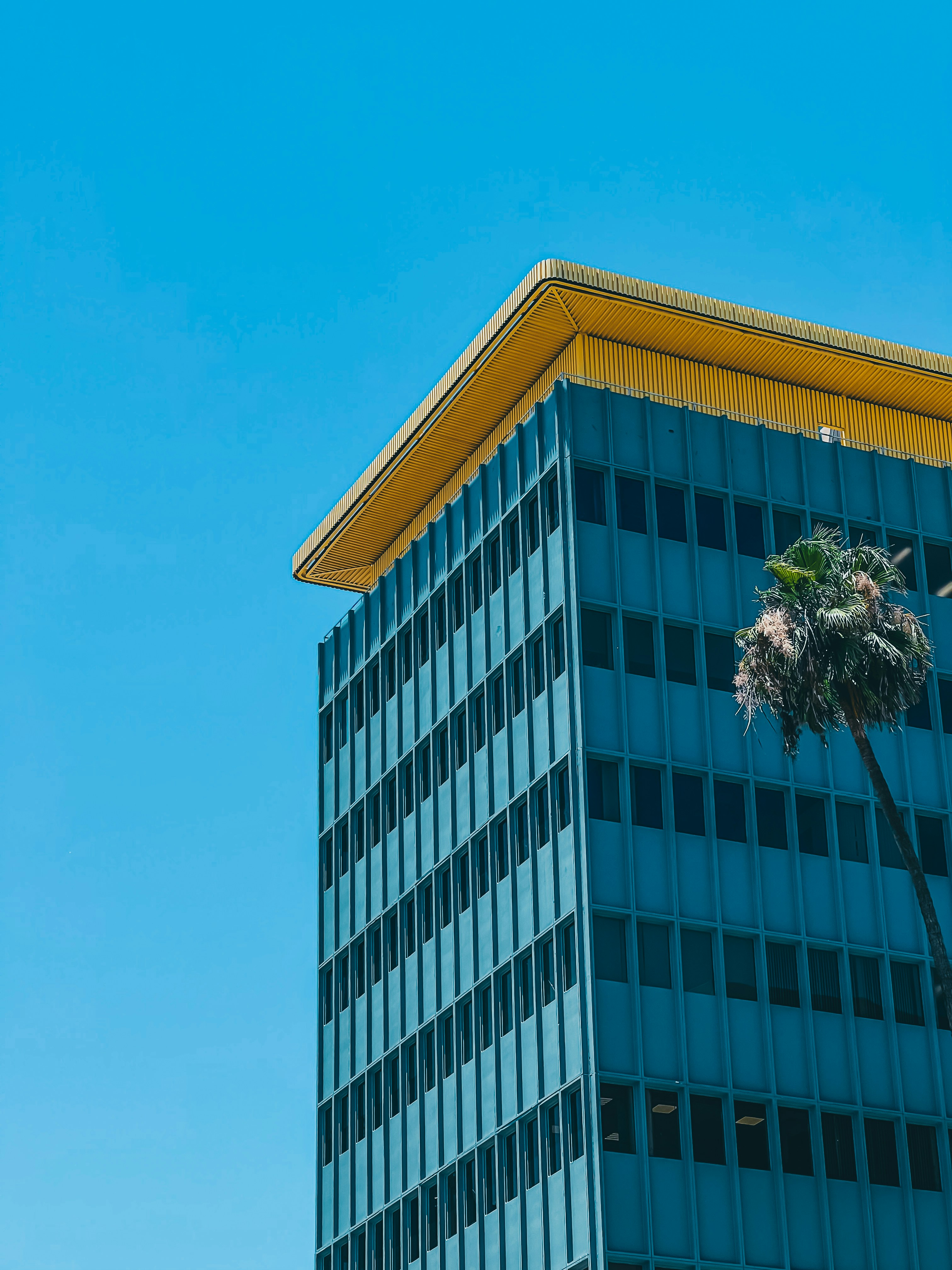 a tall building with a yellow roof
