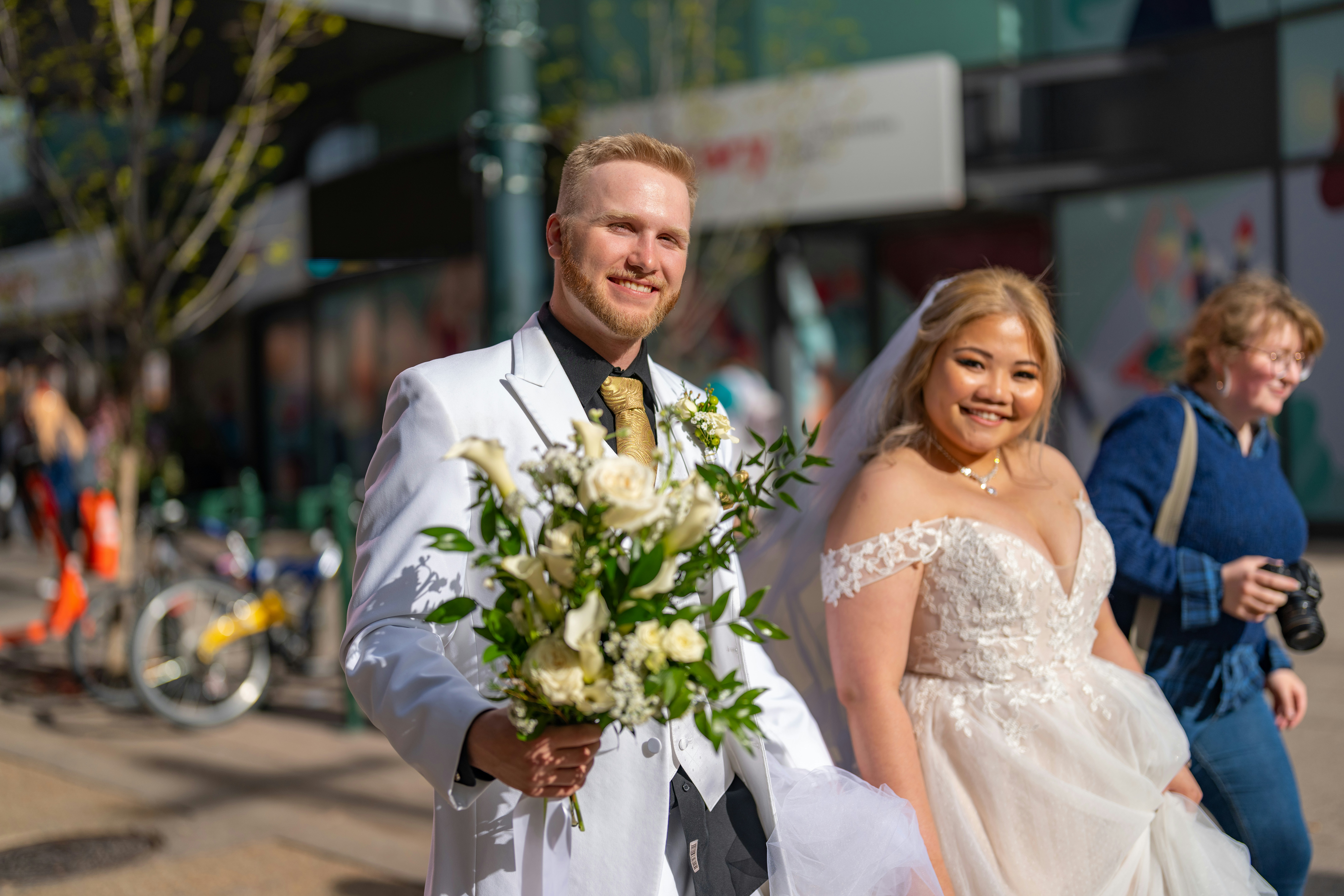 a man and woman holding flowers