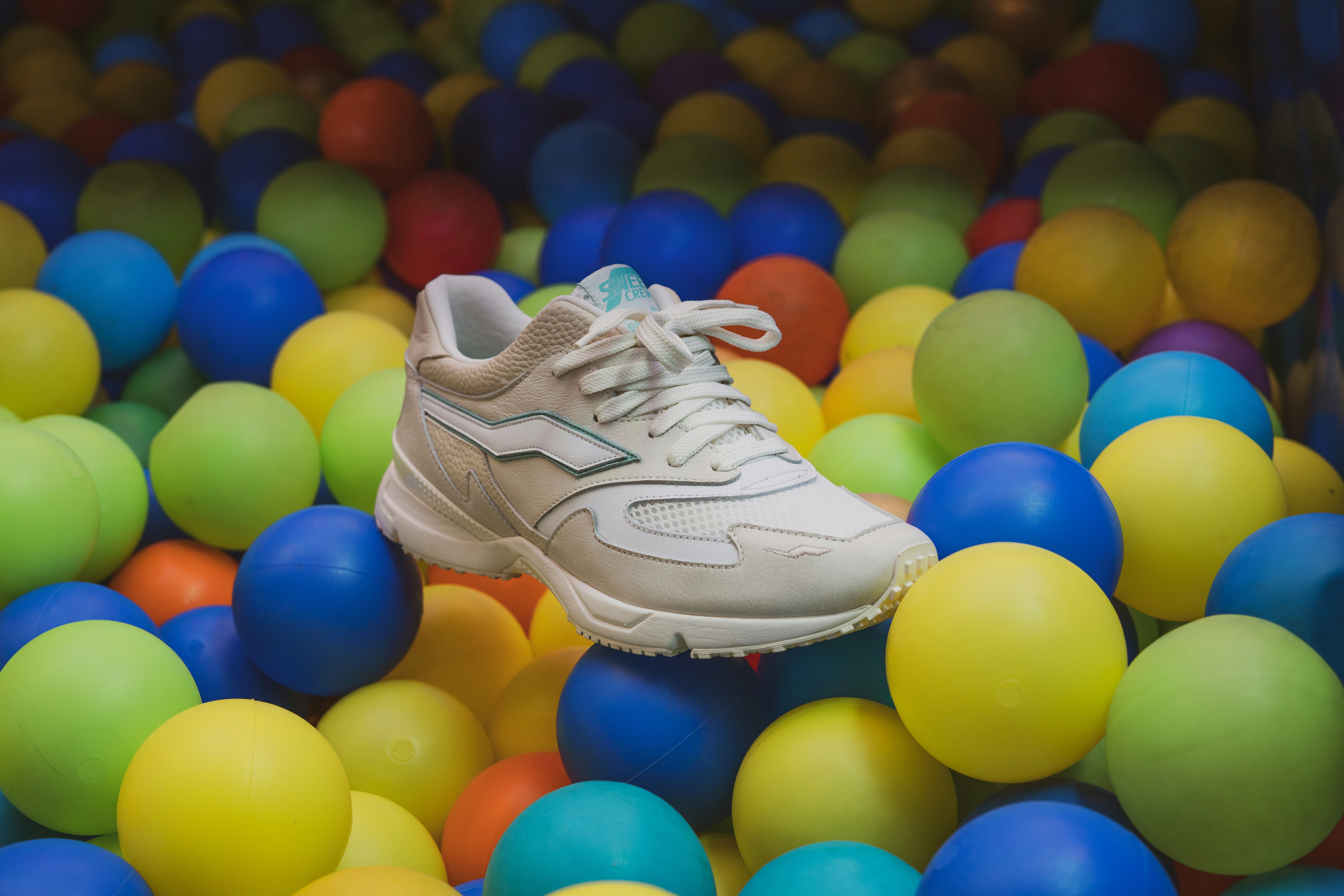 A ball in a pile of colorful balls photo – Free Apparel Image on Unsplash