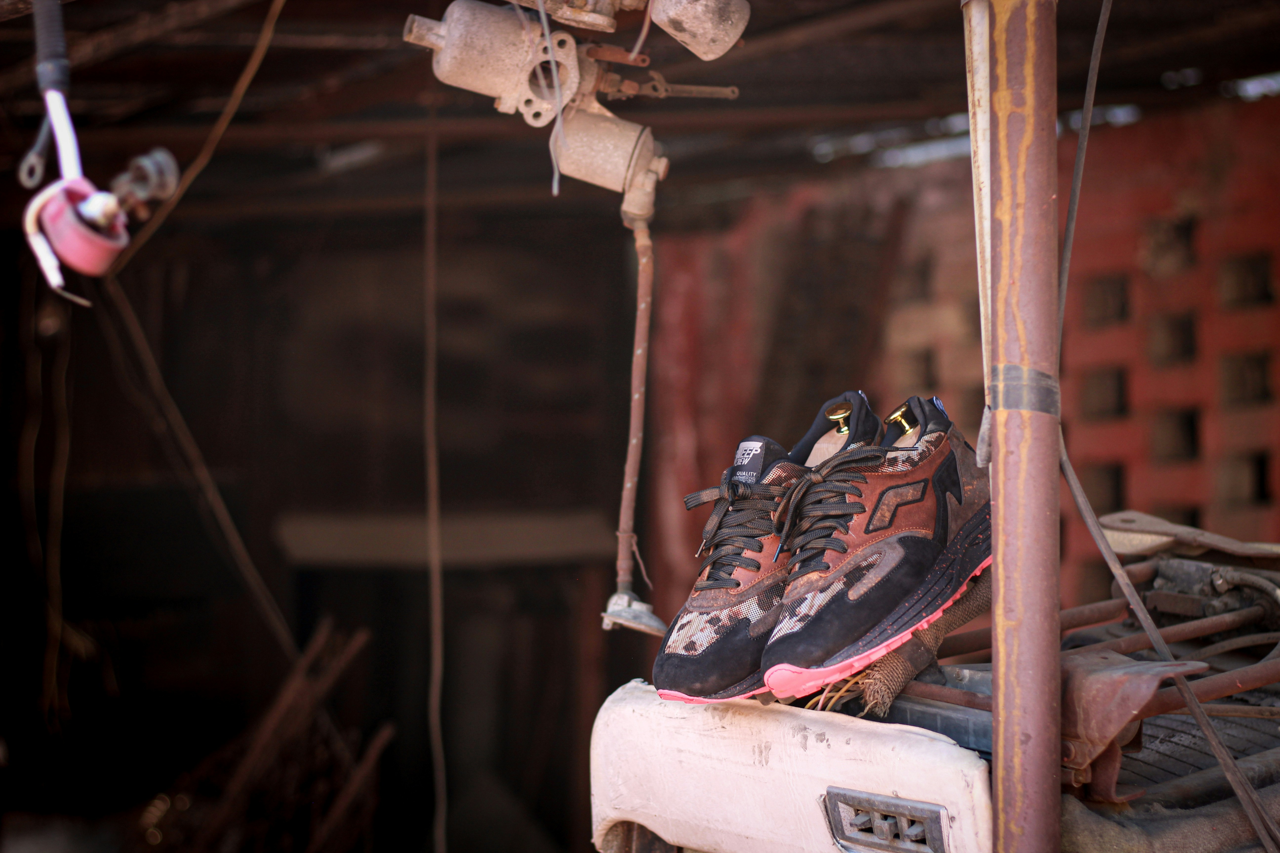 Weathered Kicks on a Rusted Shelf: A Quiet Workshop Portrait