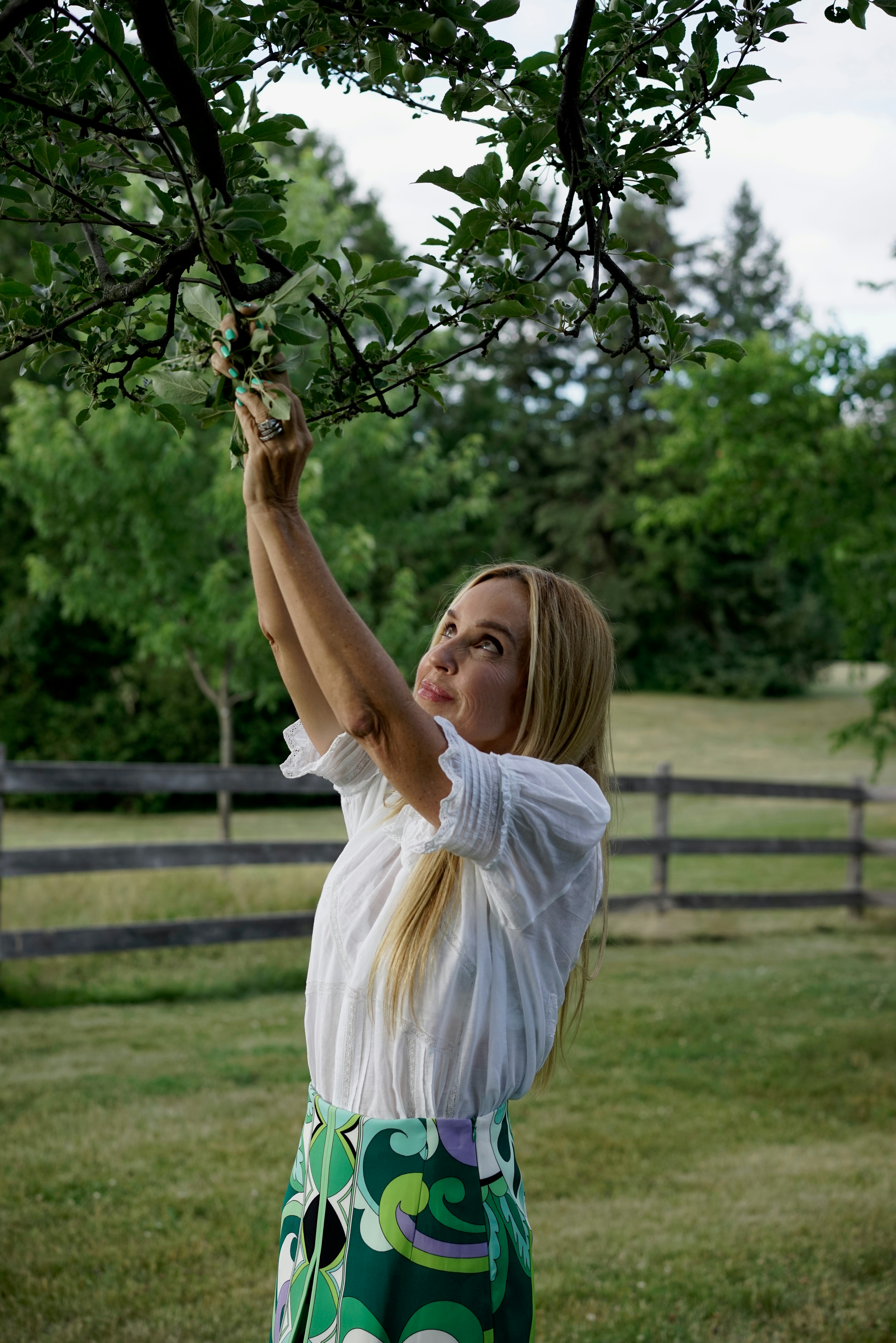 Reach Toward the Canopy: Portrait in a Sunlit Garden