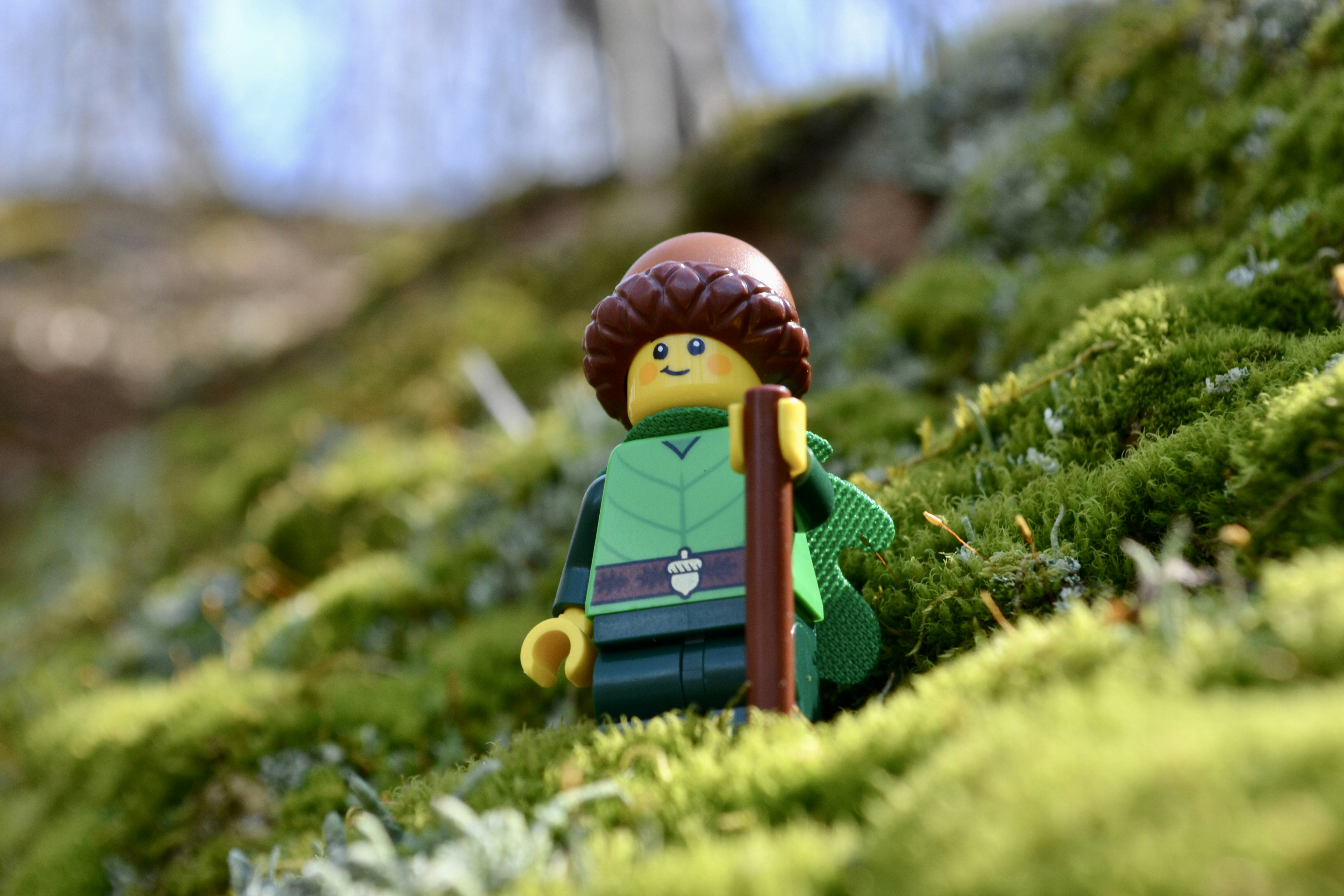Lego Ranger on a Mossy Knoll: A Tiny Hero in Green