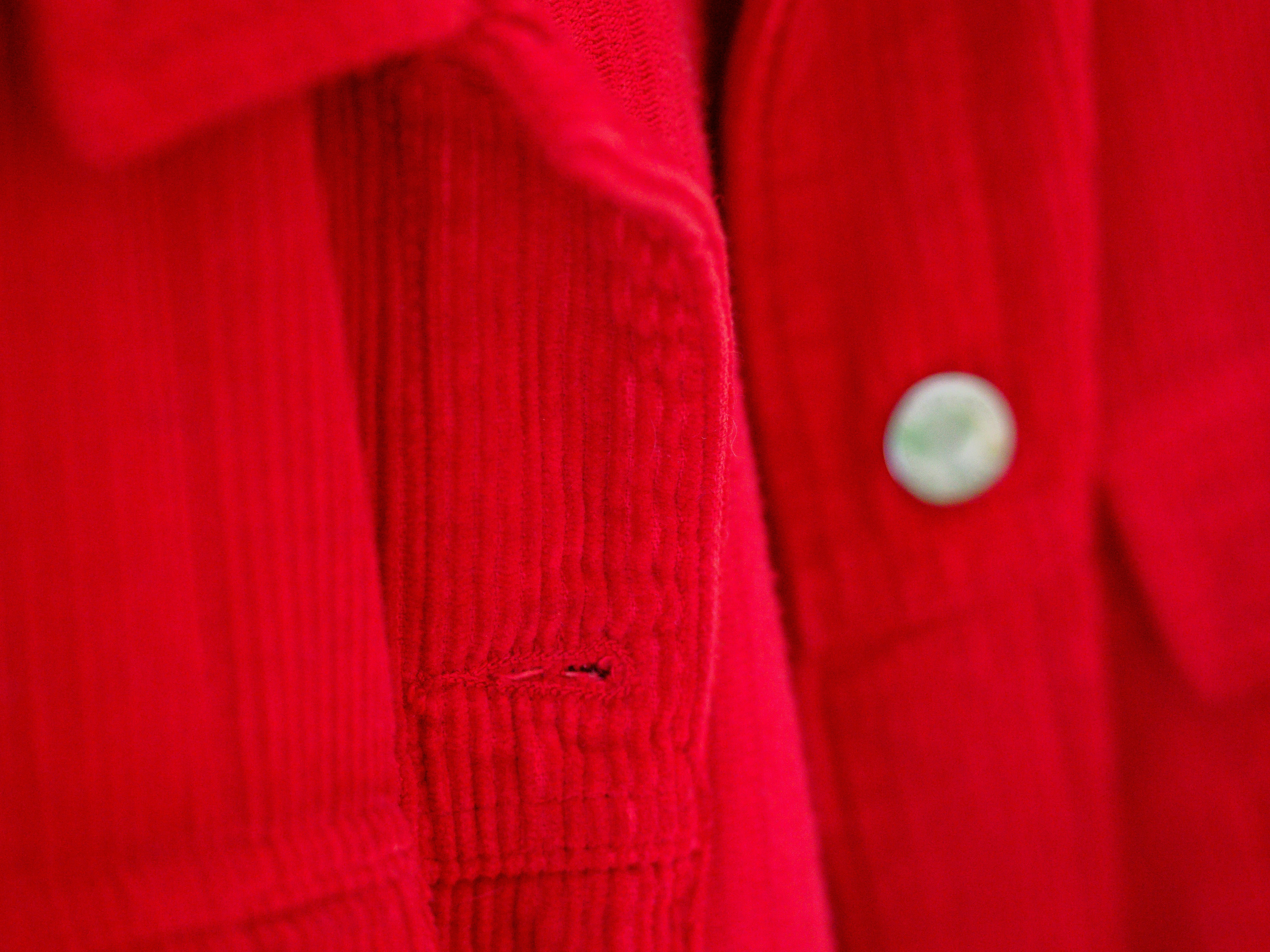 Crimson Corduroy Close-Up: A Textural Study of Red Fabric