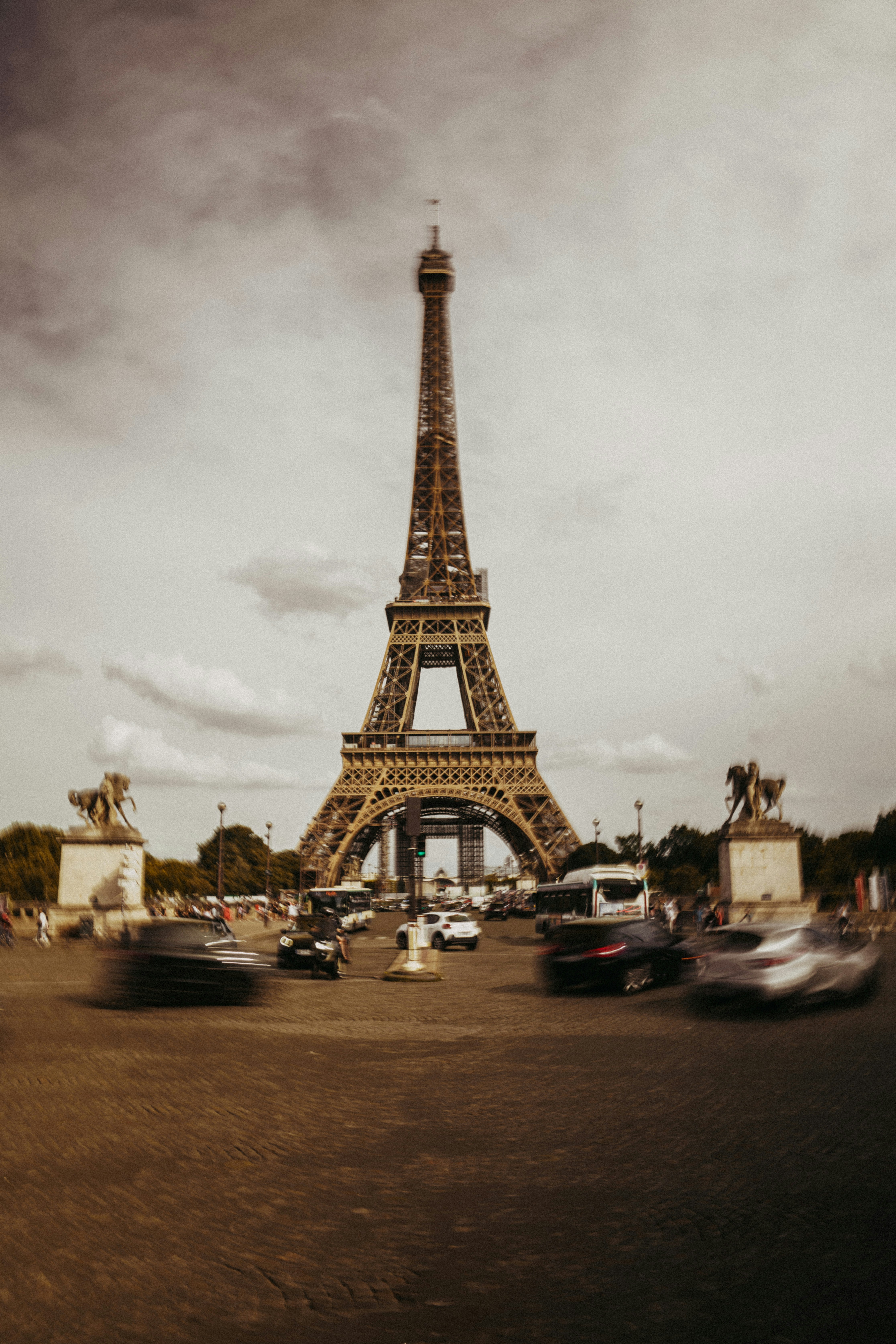 A large tower with cars parked below photo – Free Slowshutter Image on ...