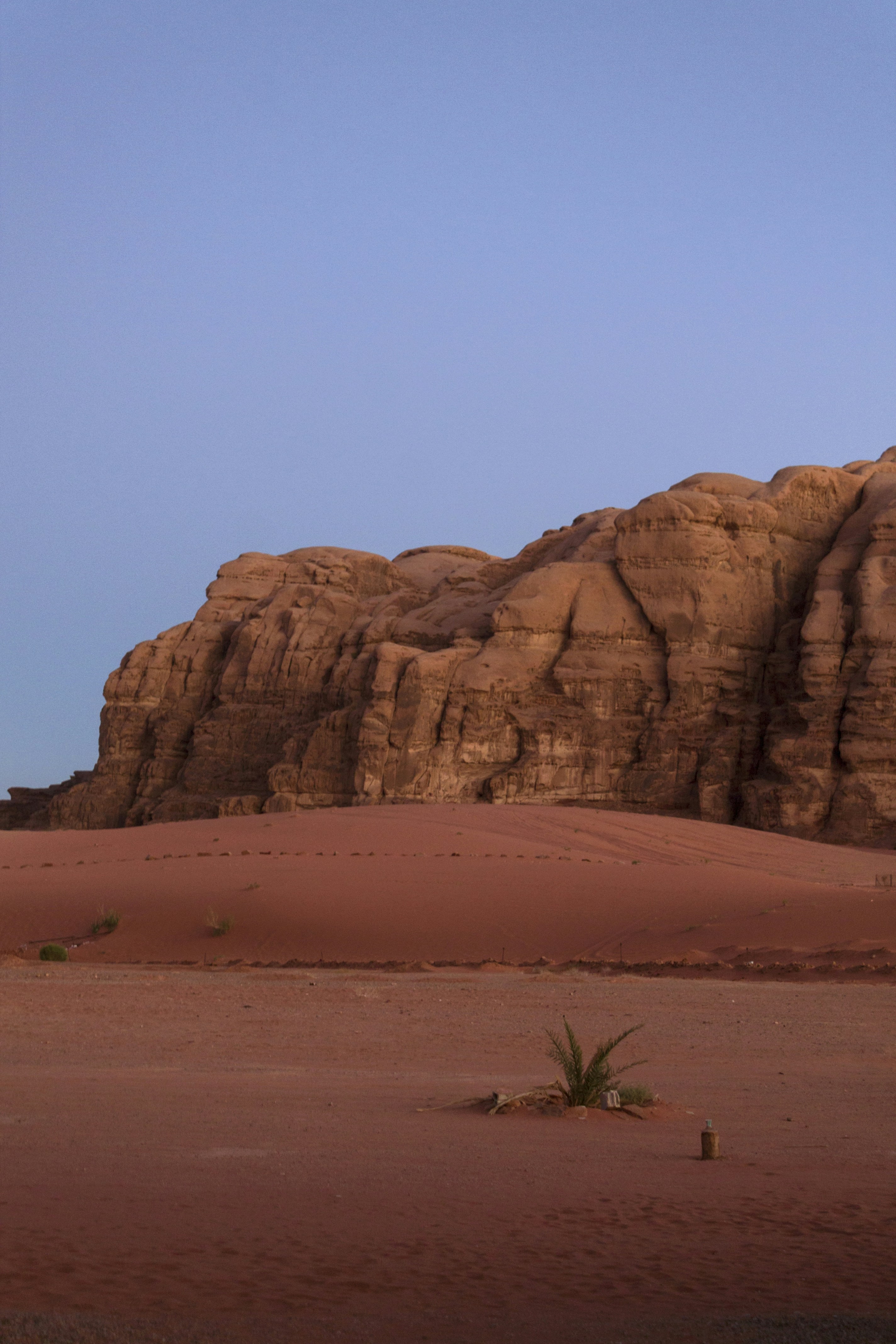 a desert landscape with a rock formation