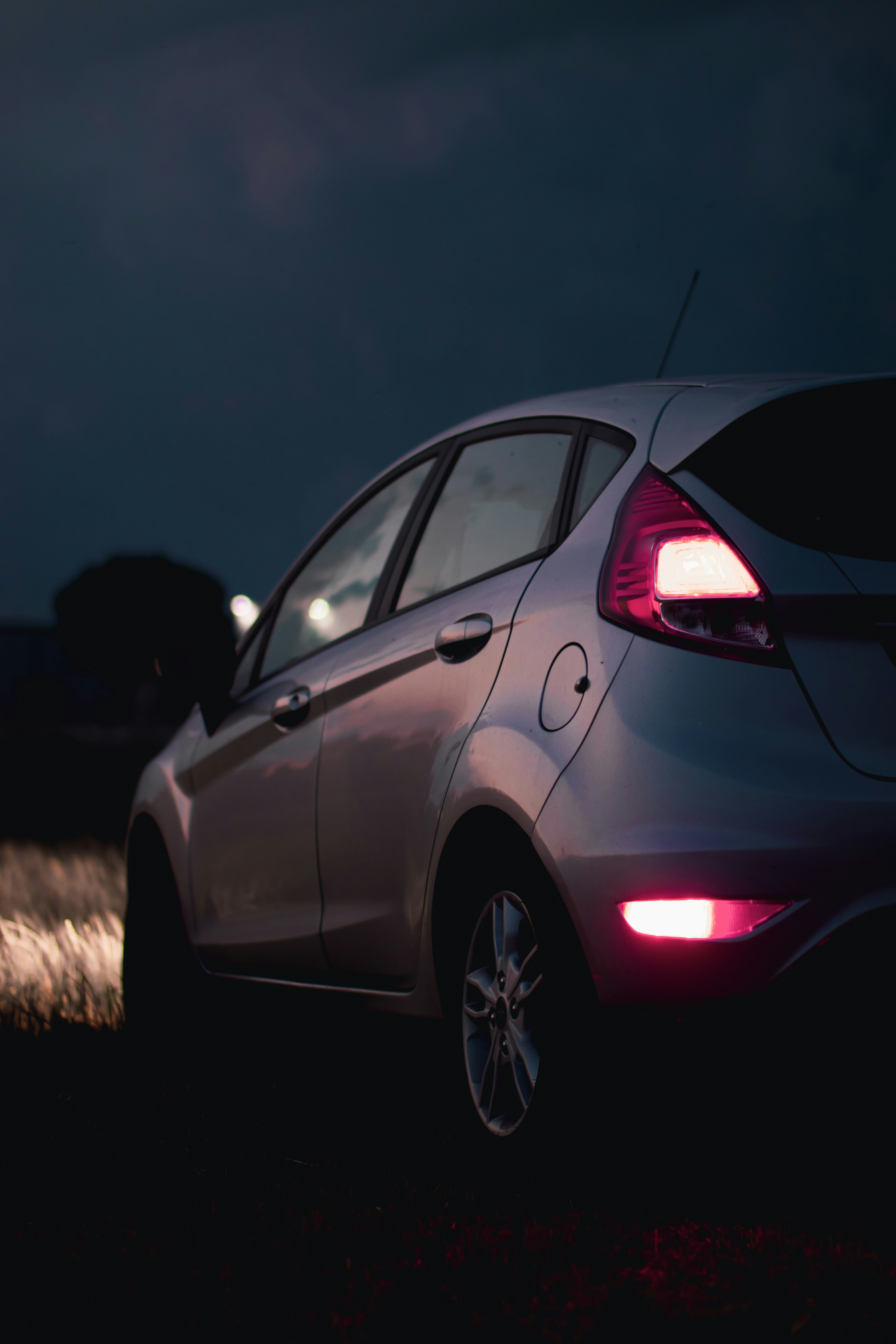Edge of Night: The Silent Hatchback with Neon Taillights