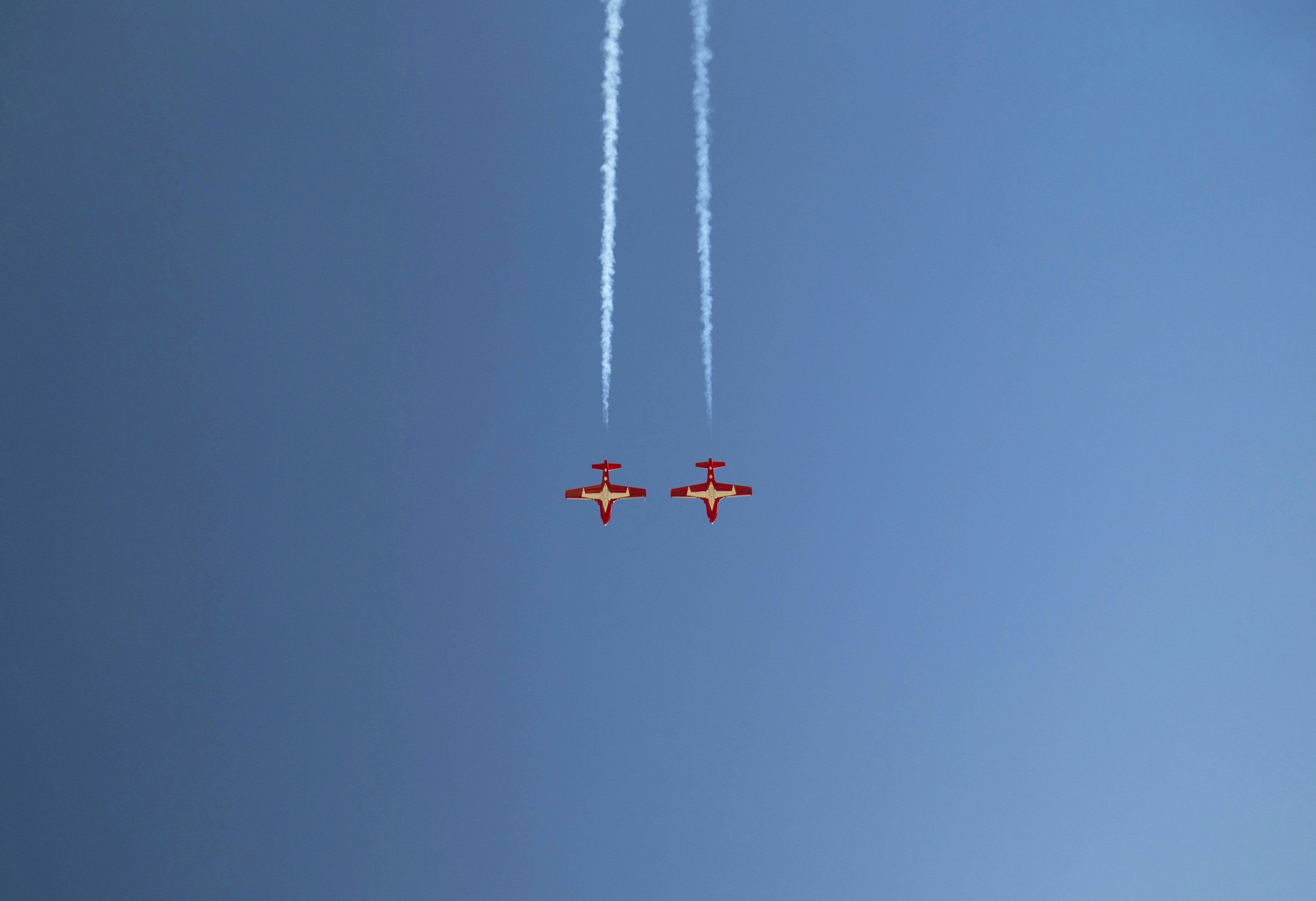 a group of airplanes flying in the sky