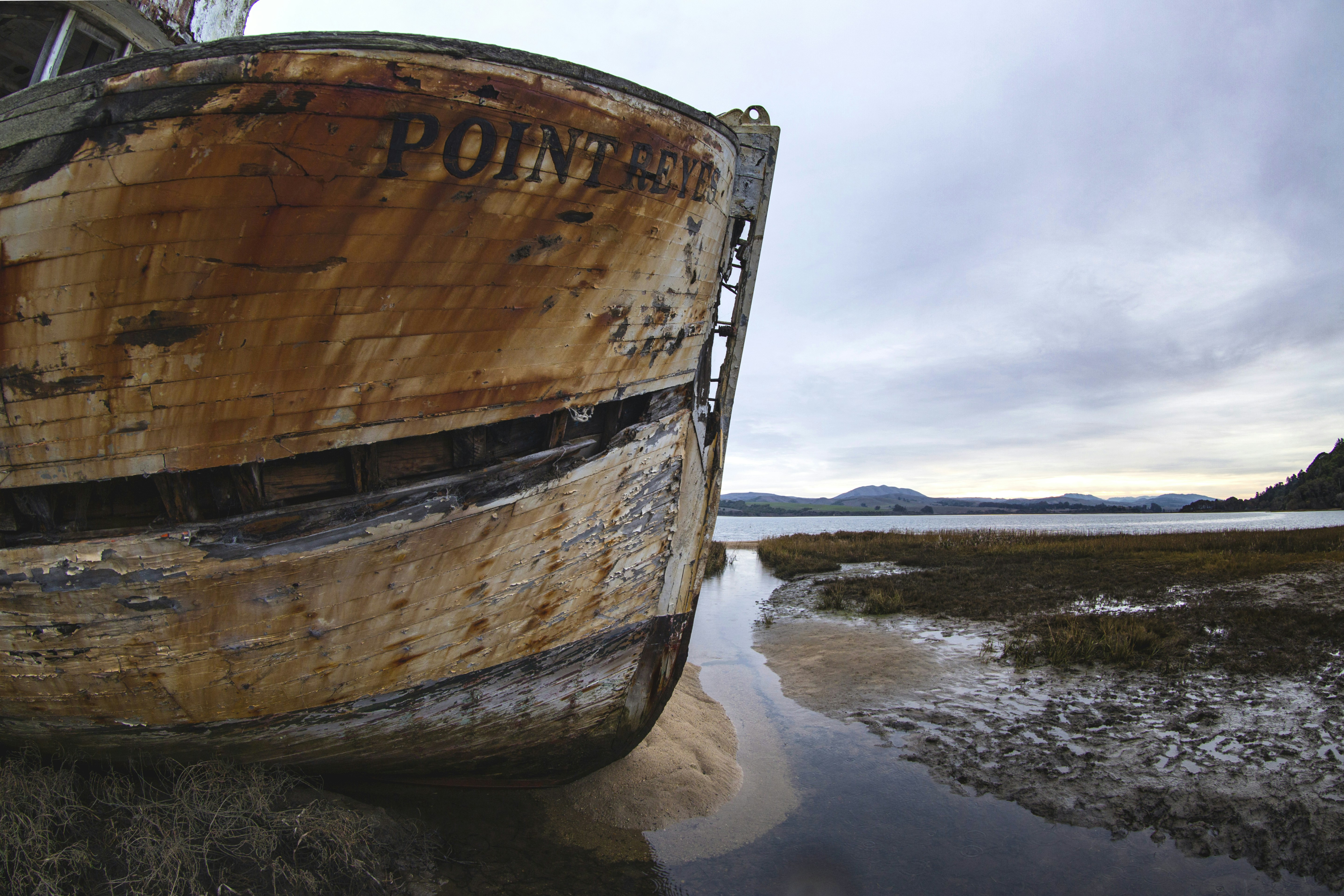 Weathered Hull on a Quiet Tide: The Bow’s Timeworn Tale