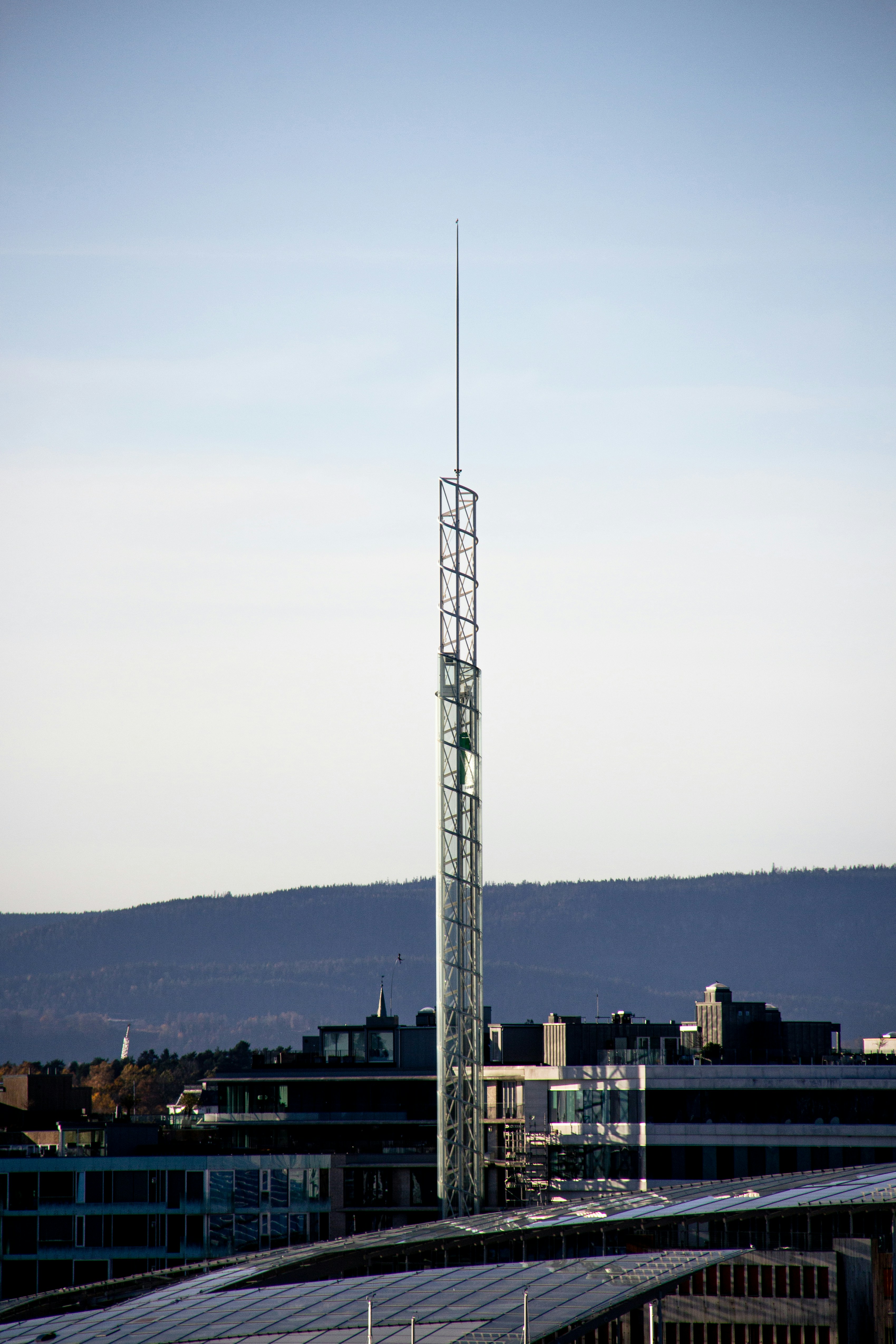 Spire of Steel Rising Over a Quiet Cityscape