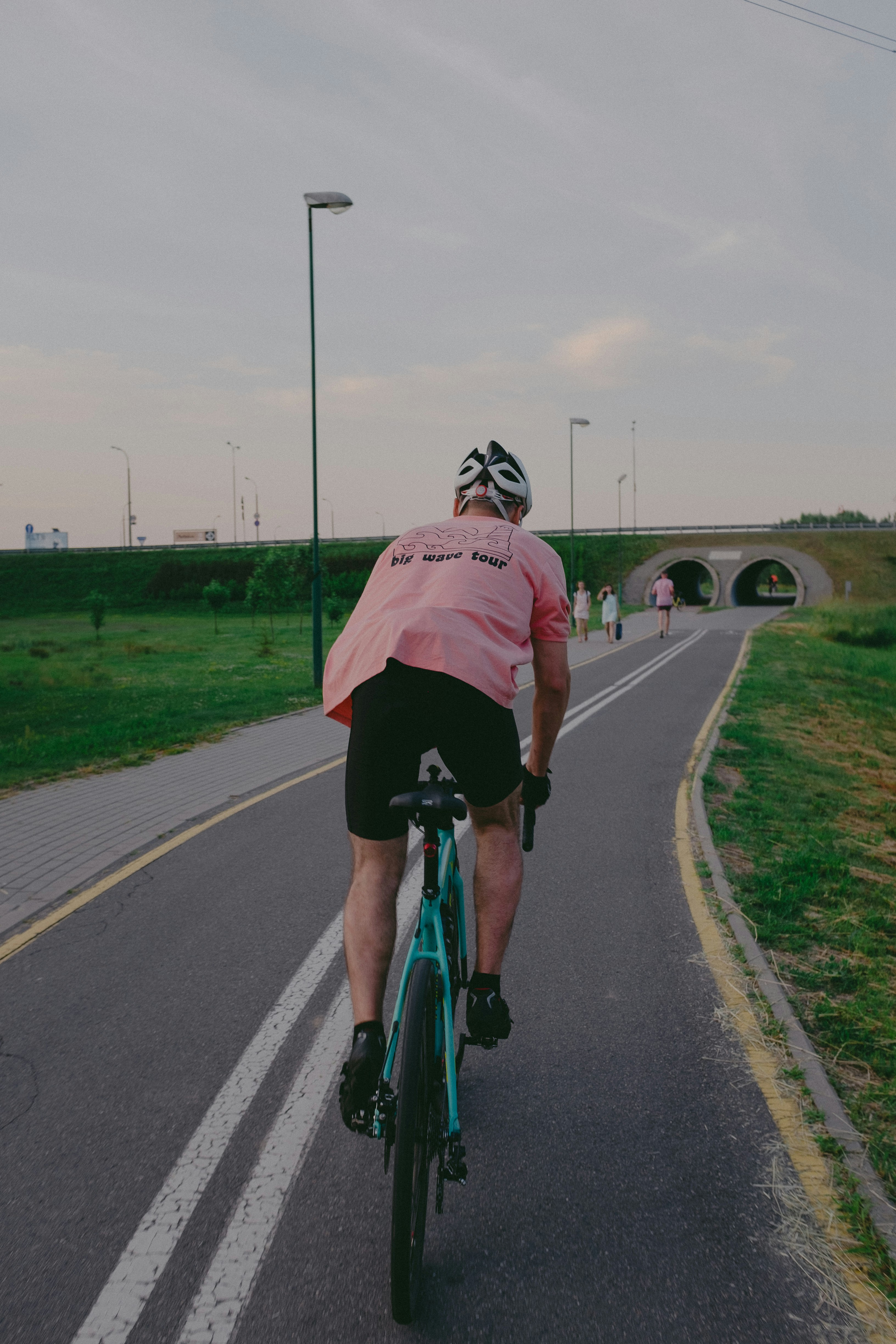 A person riding a bicycle on a road photo – Free Bike Image on Unsplash