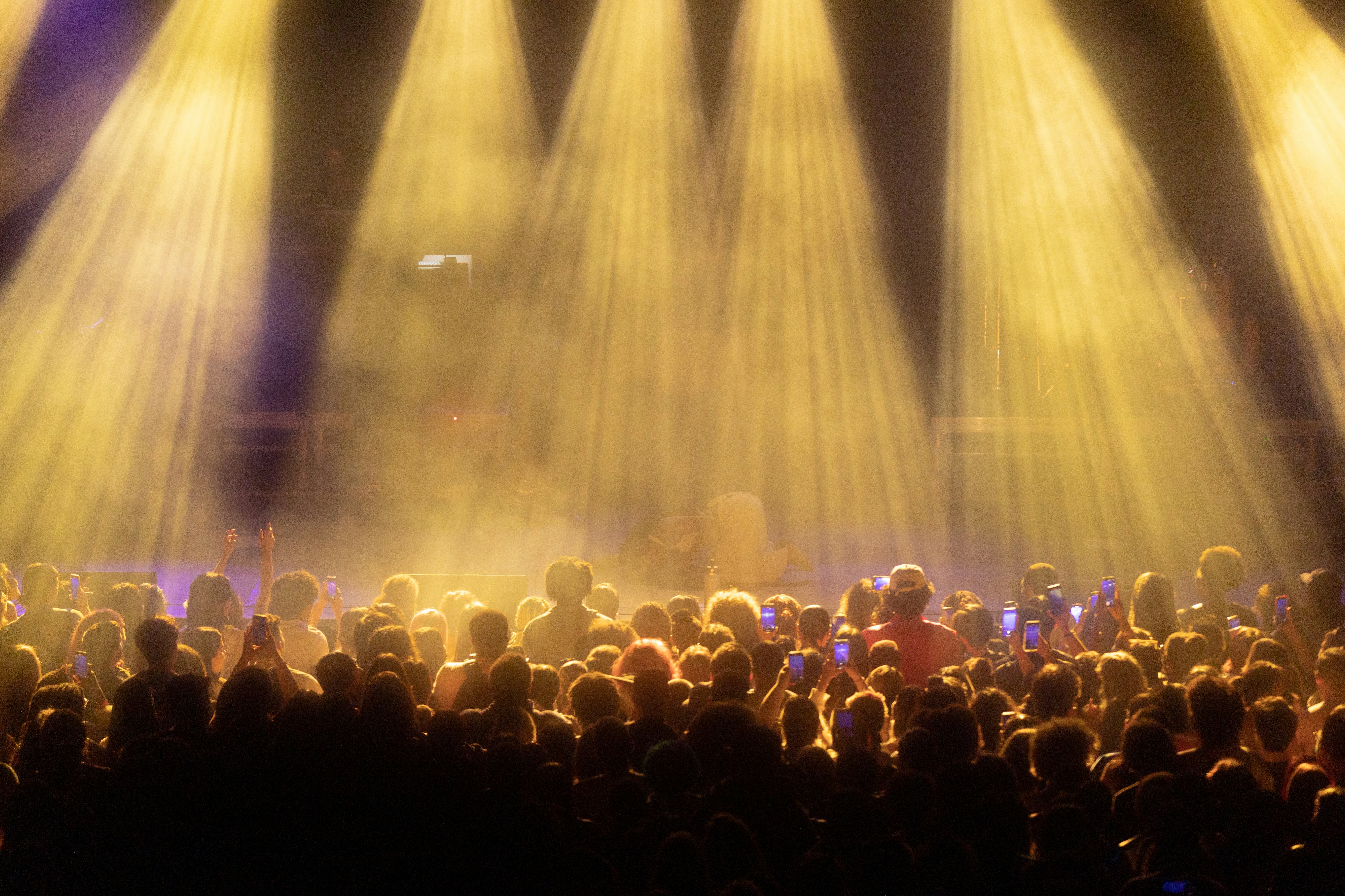 A crowd of people in front of a stage with lights photo – Free Concert ...