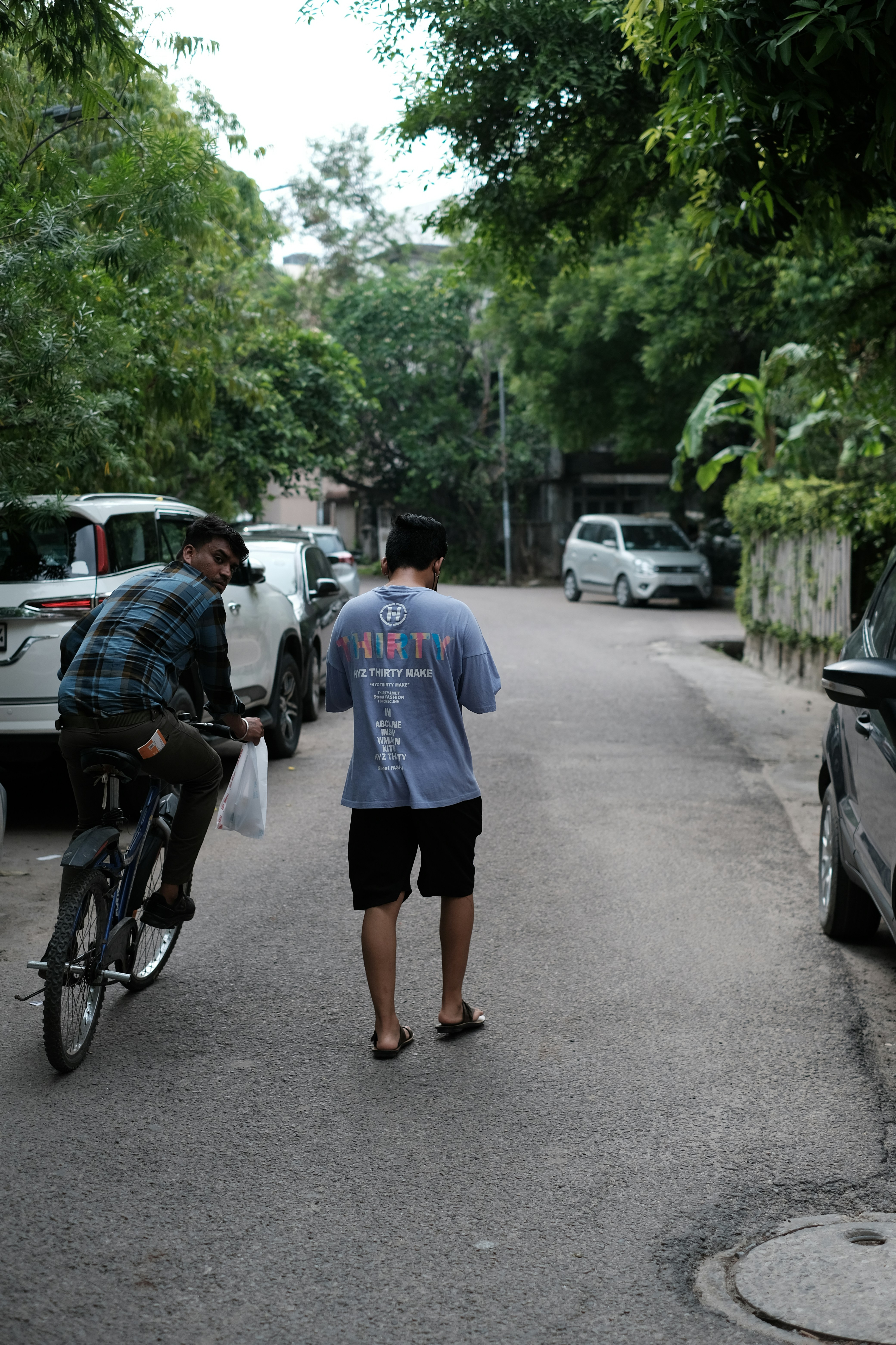 A man riding a bicycle next to a man on a bike photo – Free Man Image ...