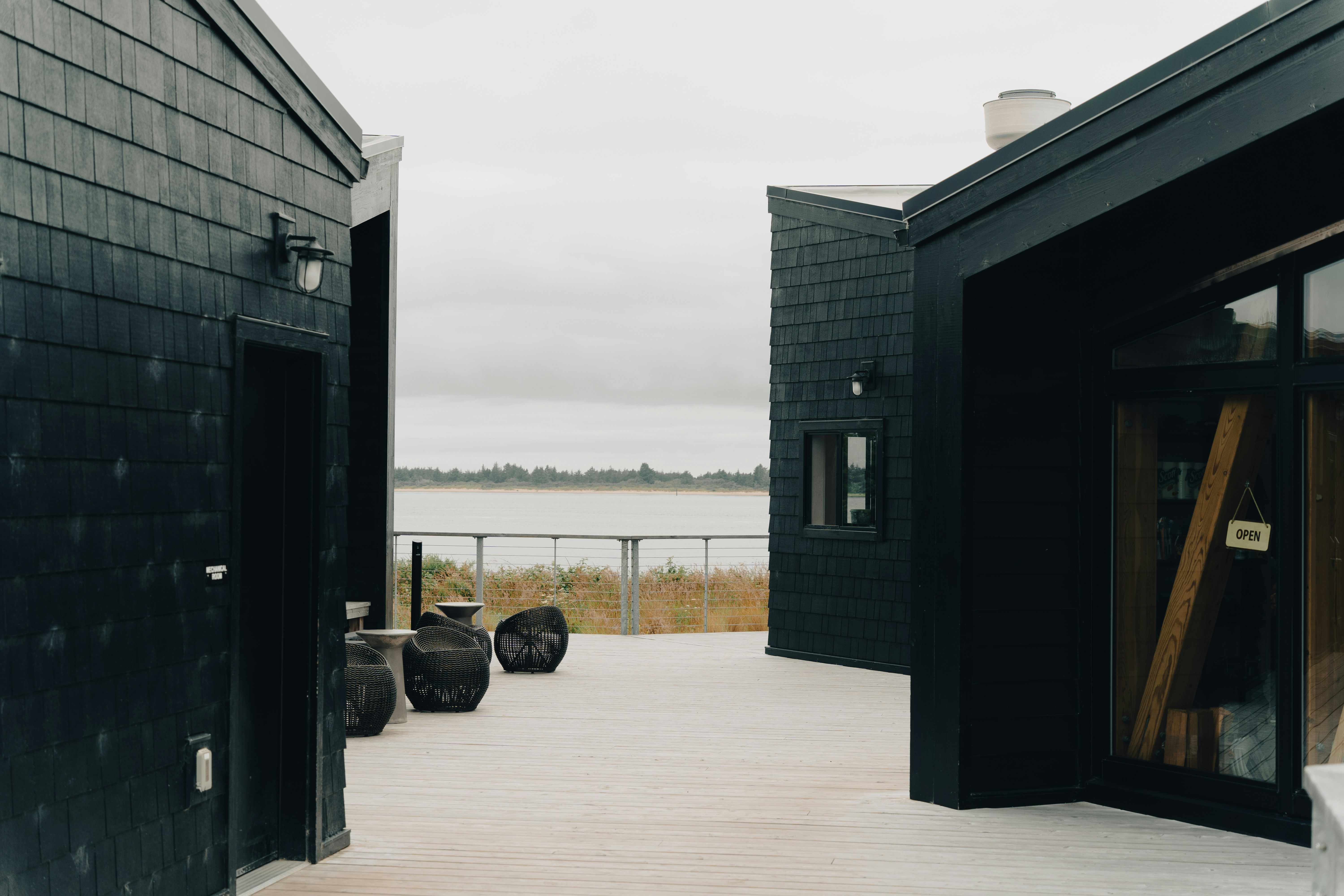 a building with a body of water in the background