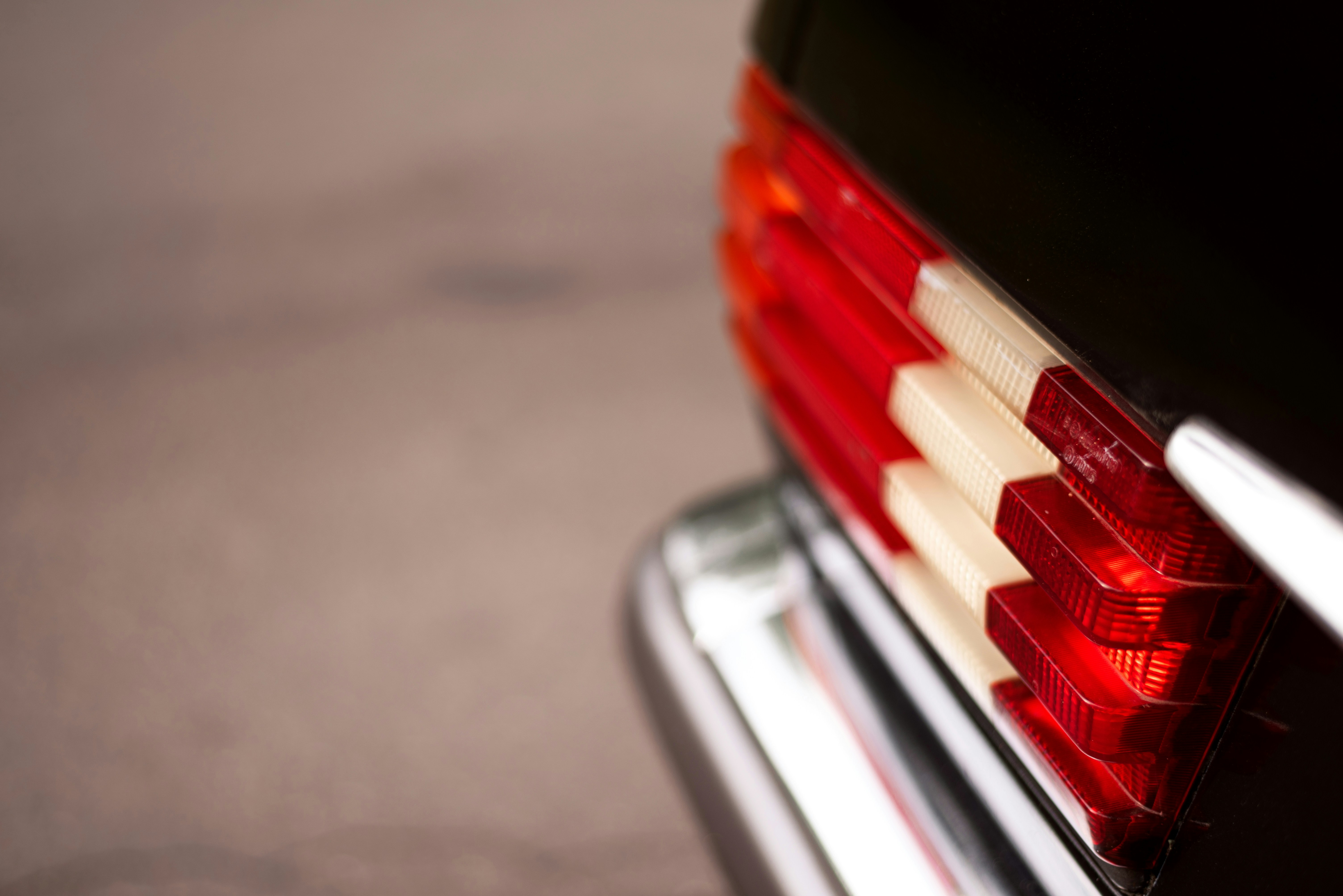 Rear Corner Taillight Geometry: A Close-Up of Red and White Strips