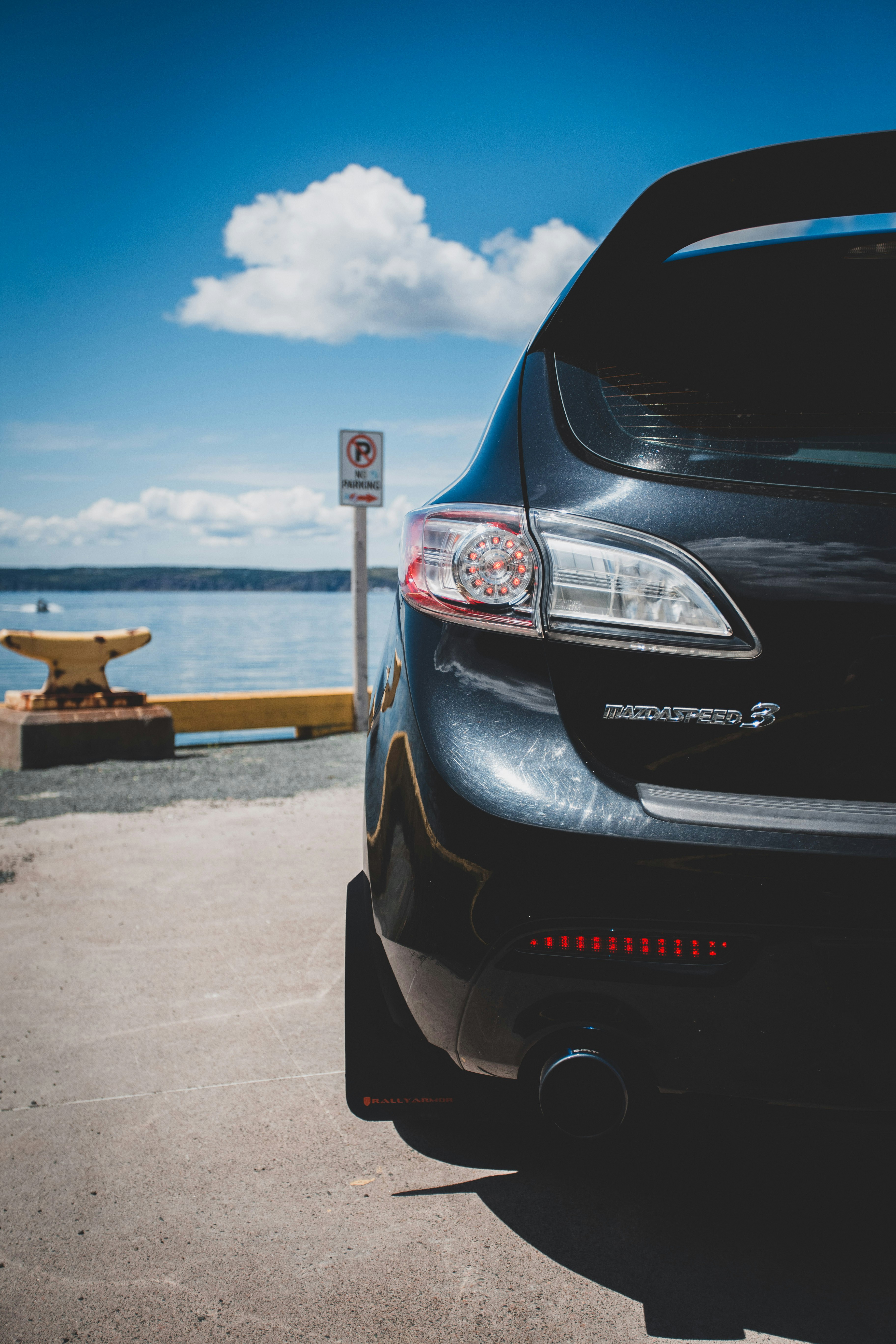 A black car parked on a dock photo – Free Vehicle Image on Unsplash