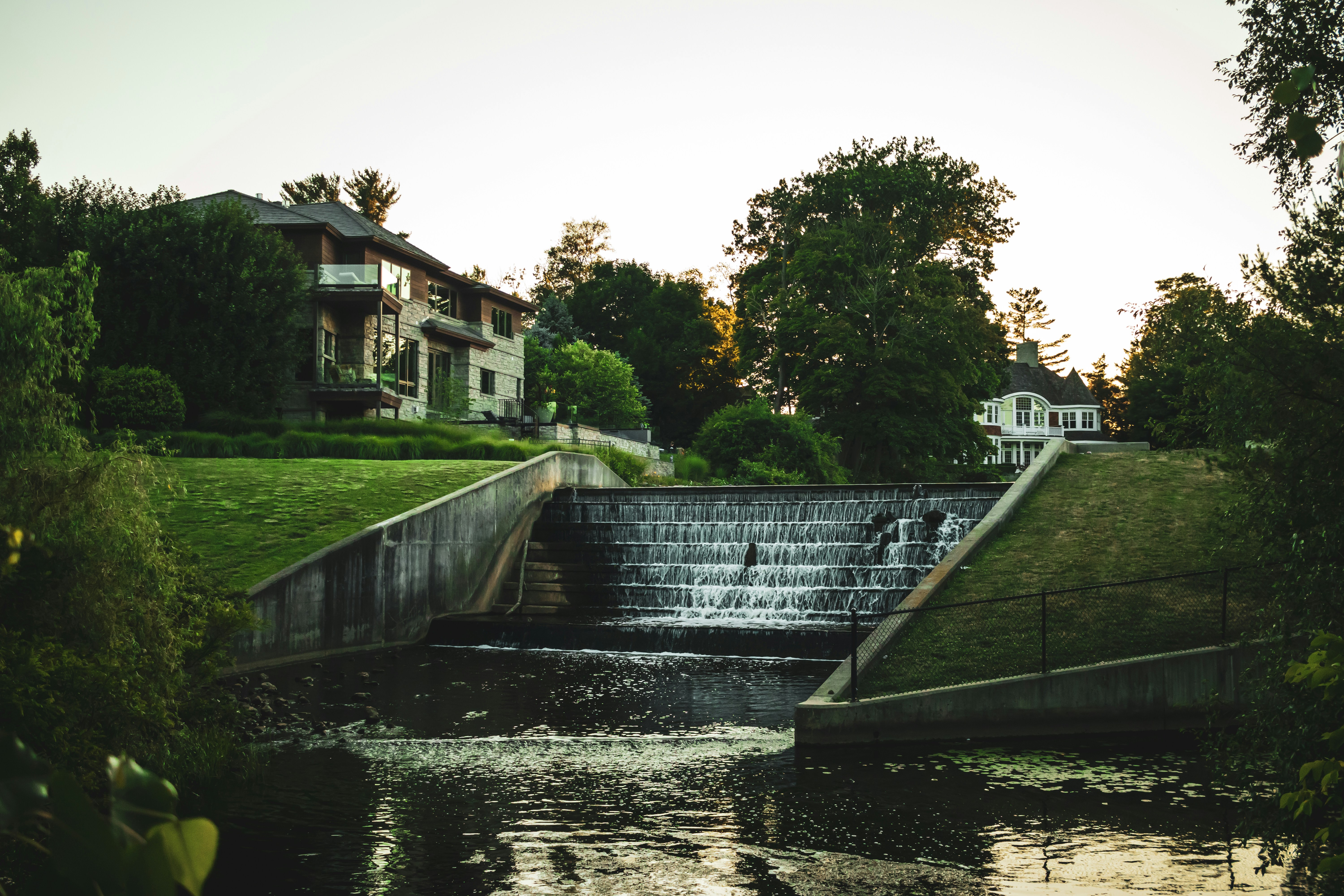 A small waterfall in a neighborhood photo – Free Water Image on Unsplash