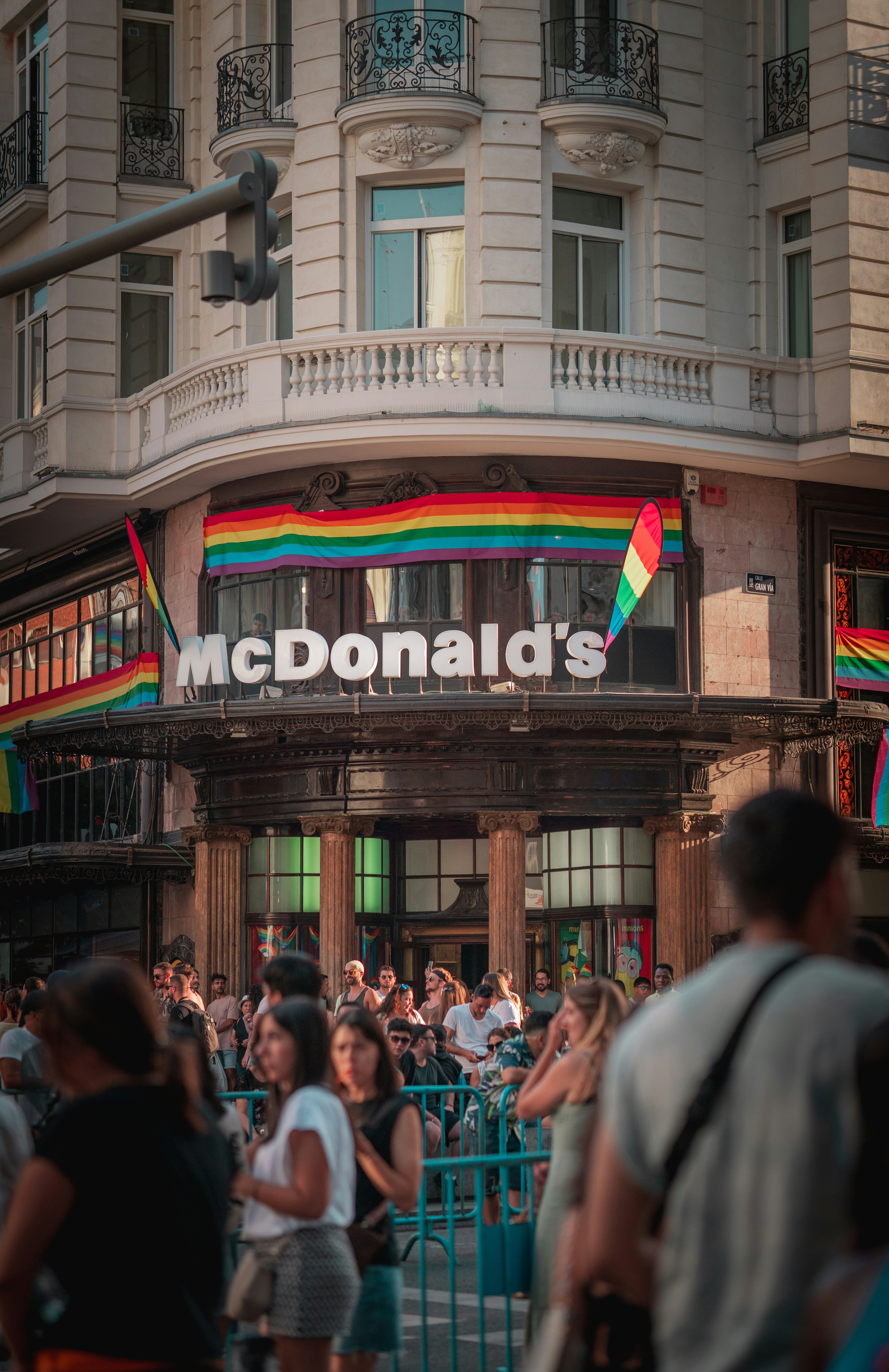 Rainbow at the Door: Crowd, McDonald’s, and Pride on a City Corner