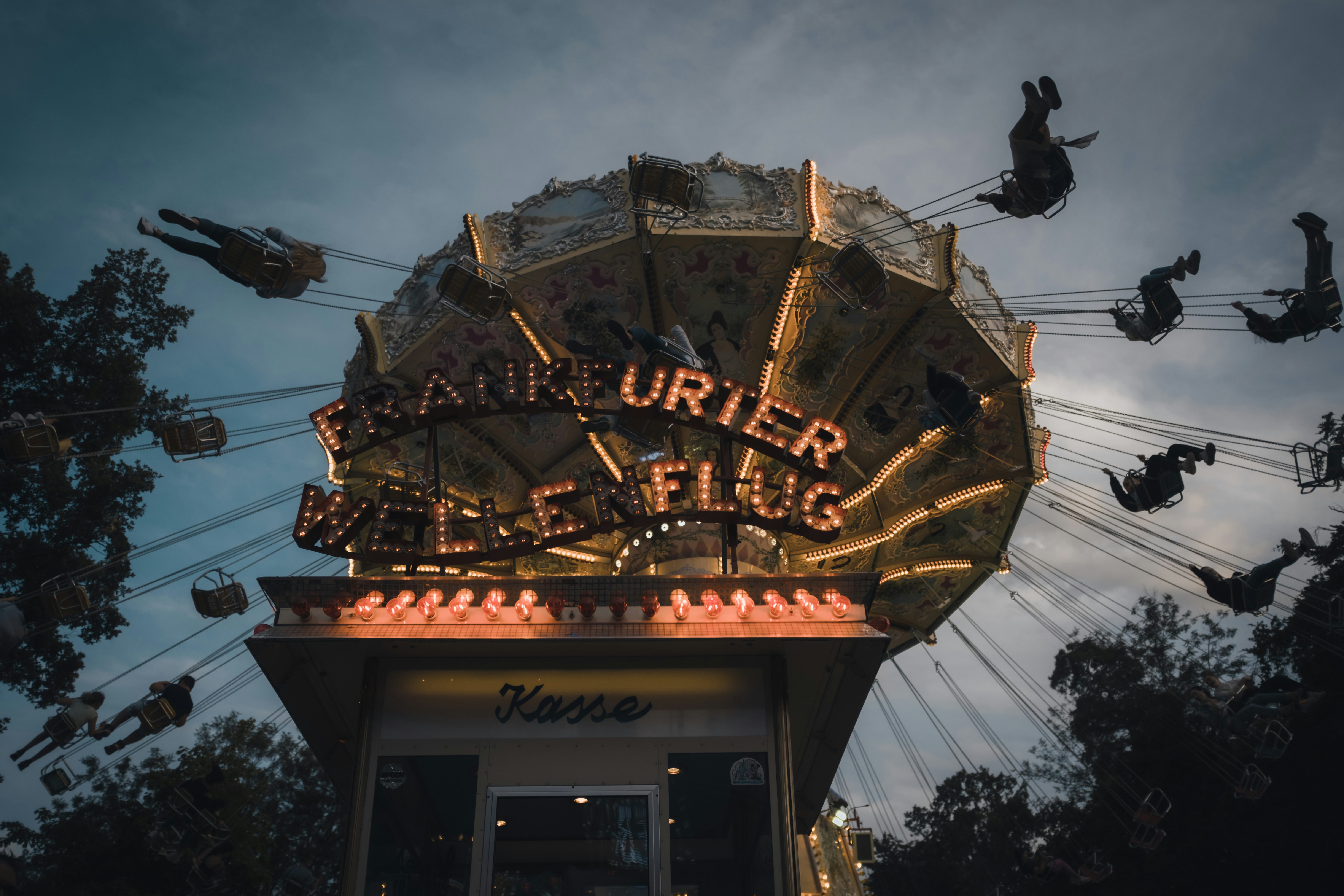 Neon-Charged Swing Carousel at Dusk