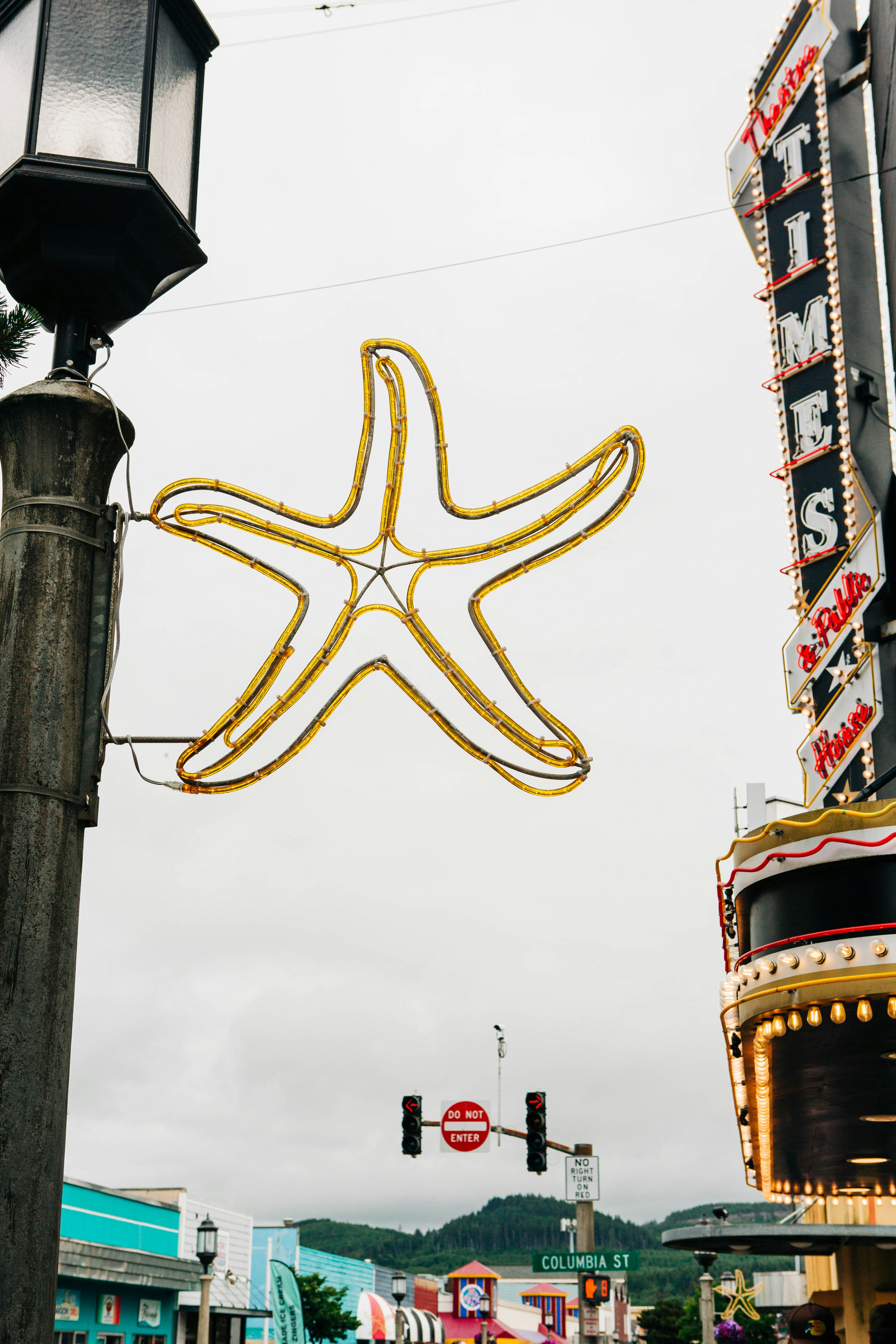 Neon Starfish Above a Retro Theater Row
