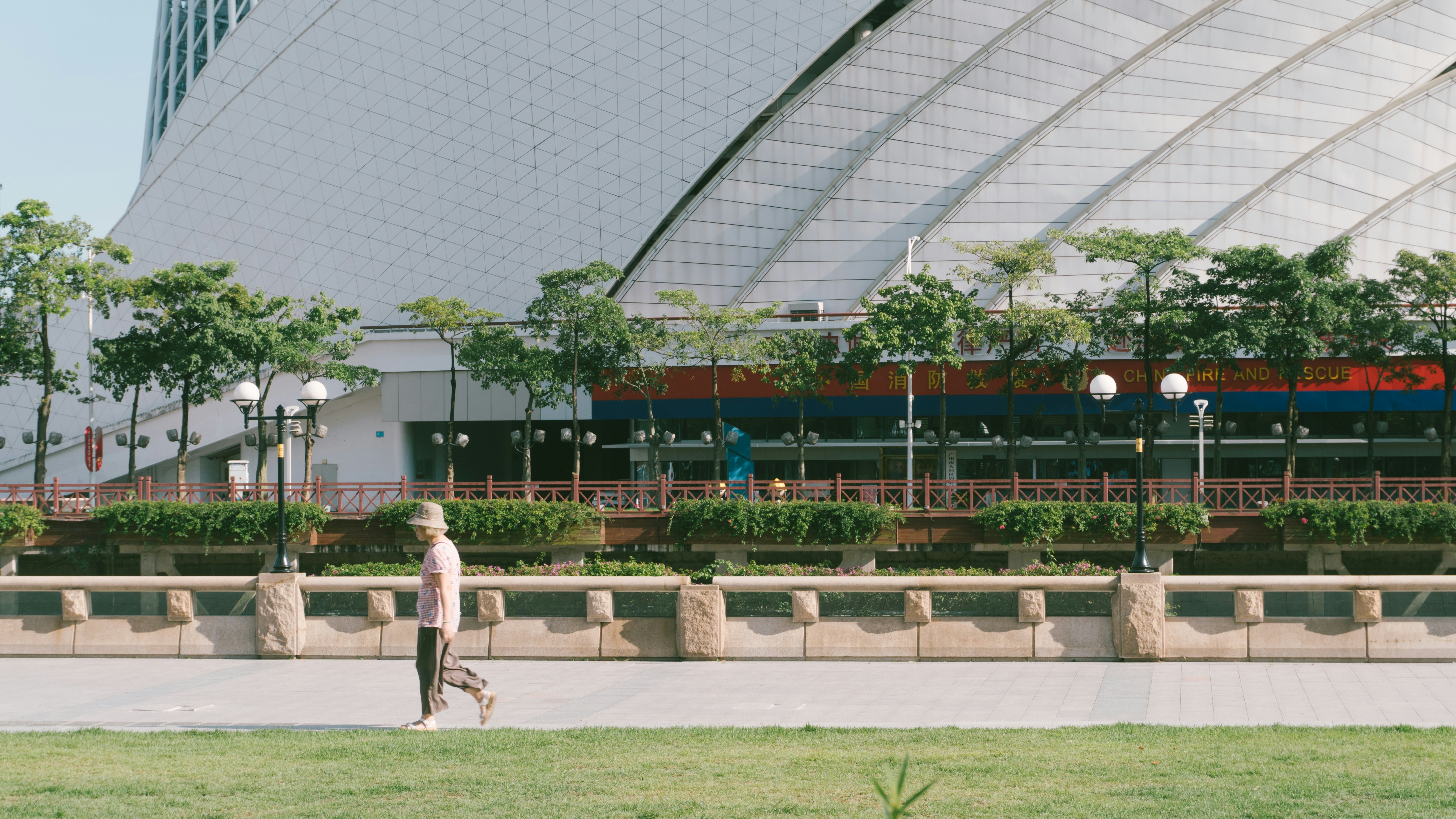 a person walking in front of a building