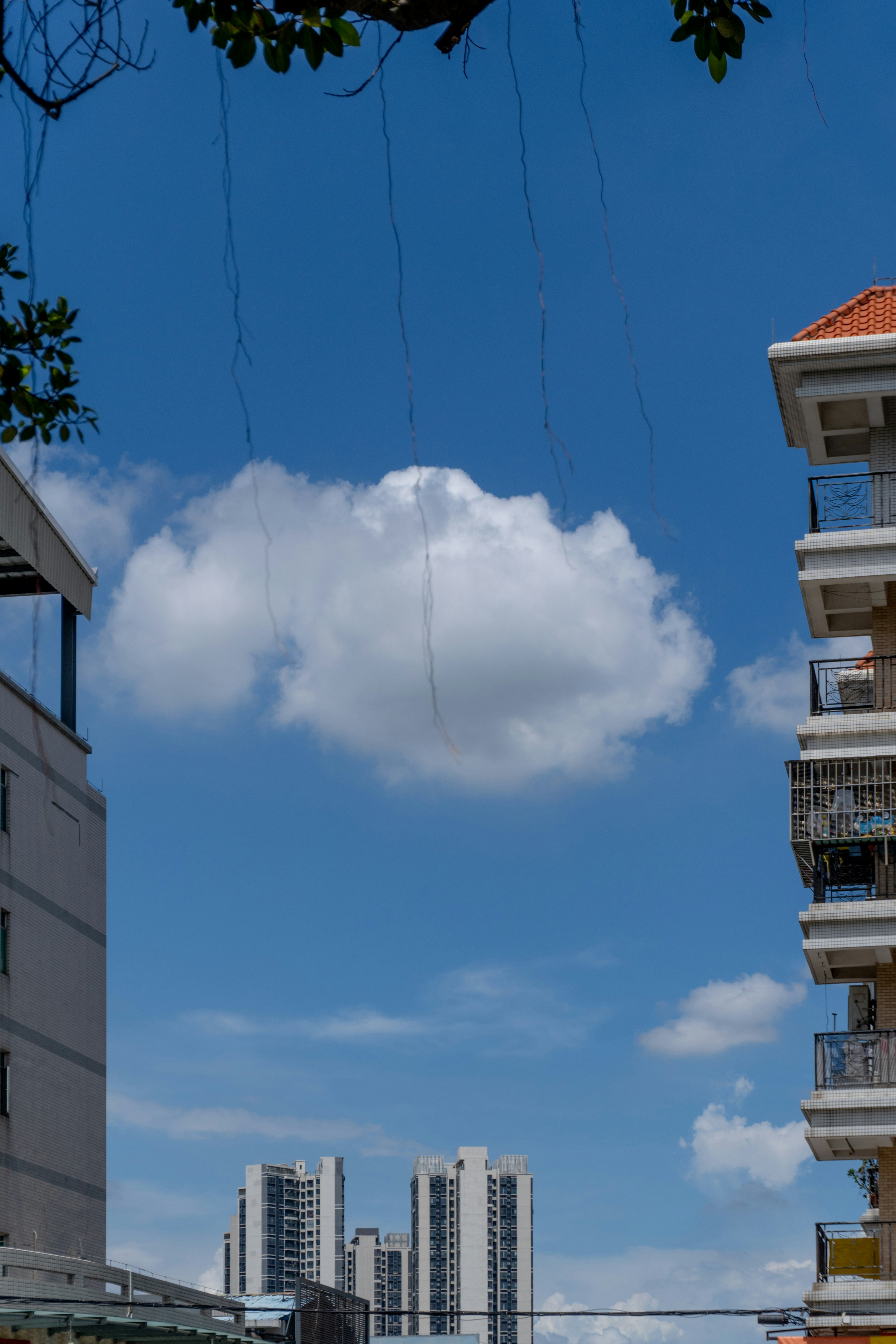 a group of buildings with a blue sky above