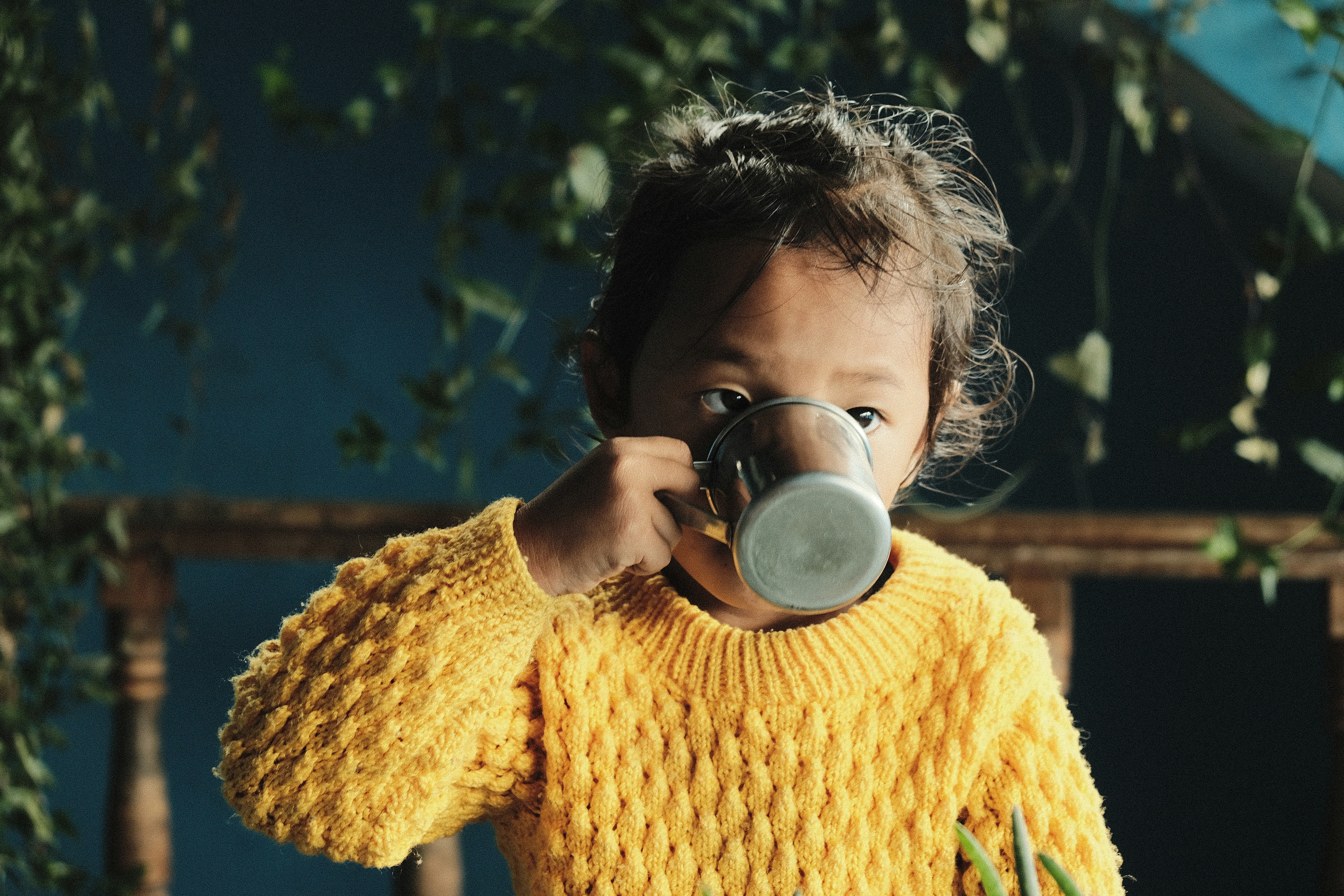 Yellow-Knitted Cozy: A Quiet Moment with Tea
