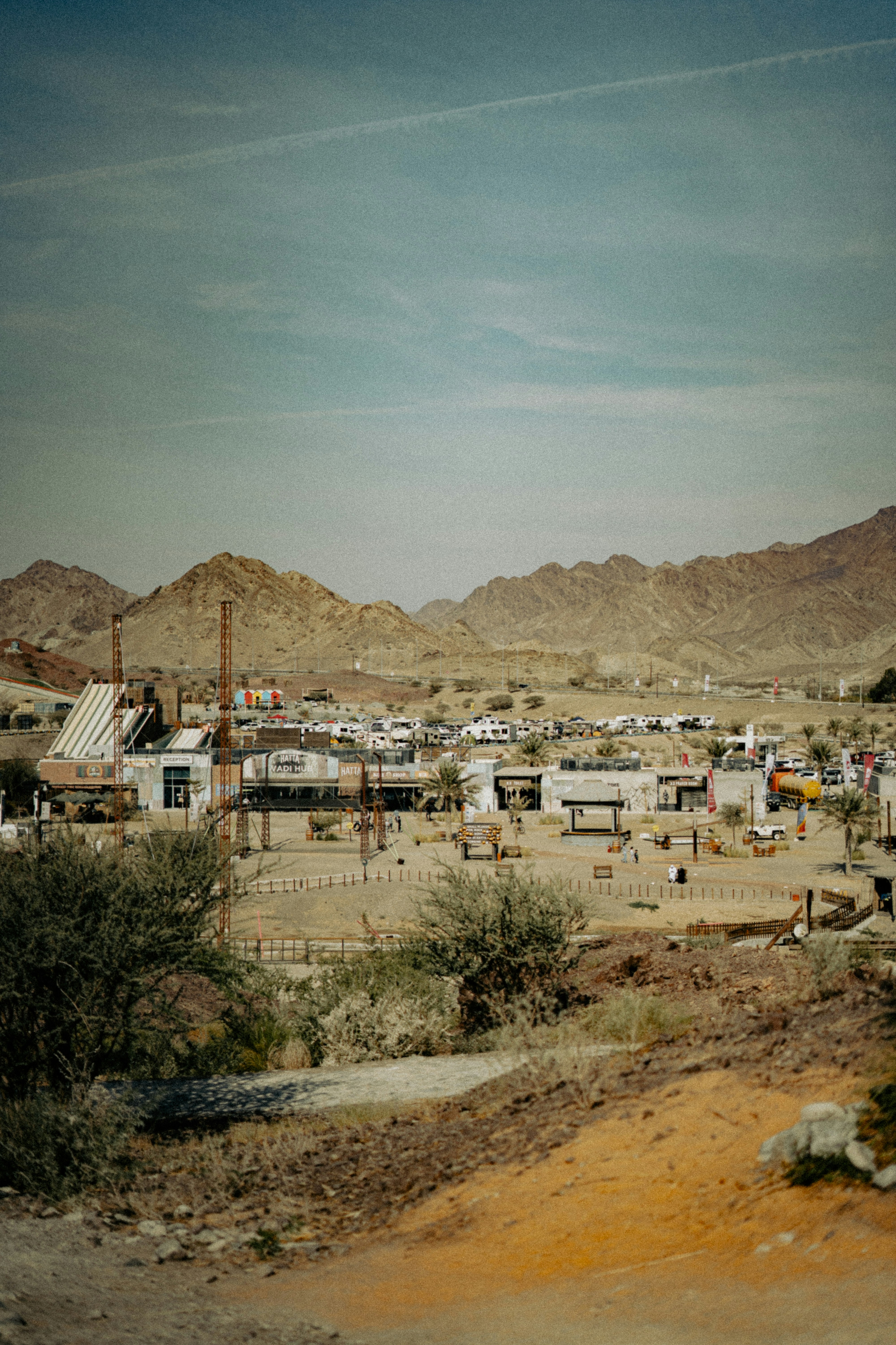 Desert Midway Nestled Between Sand Roads and a Mountain Mirage