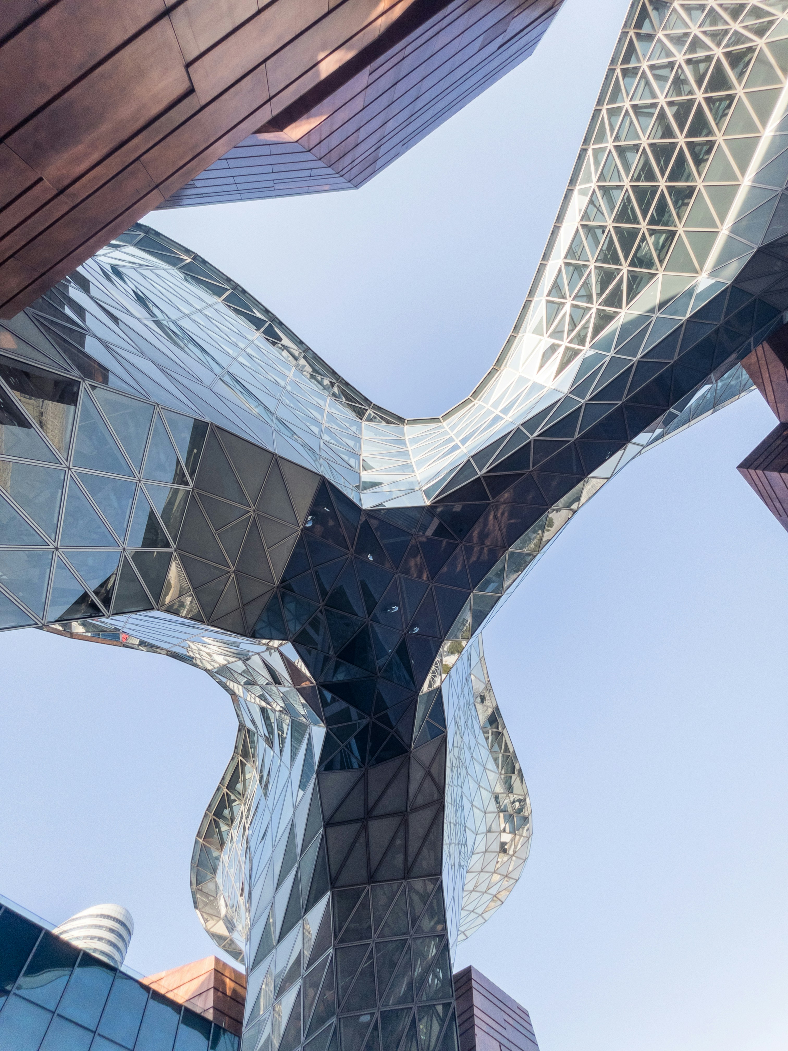 Convergence Above: The Skyward X of Glass and Steel