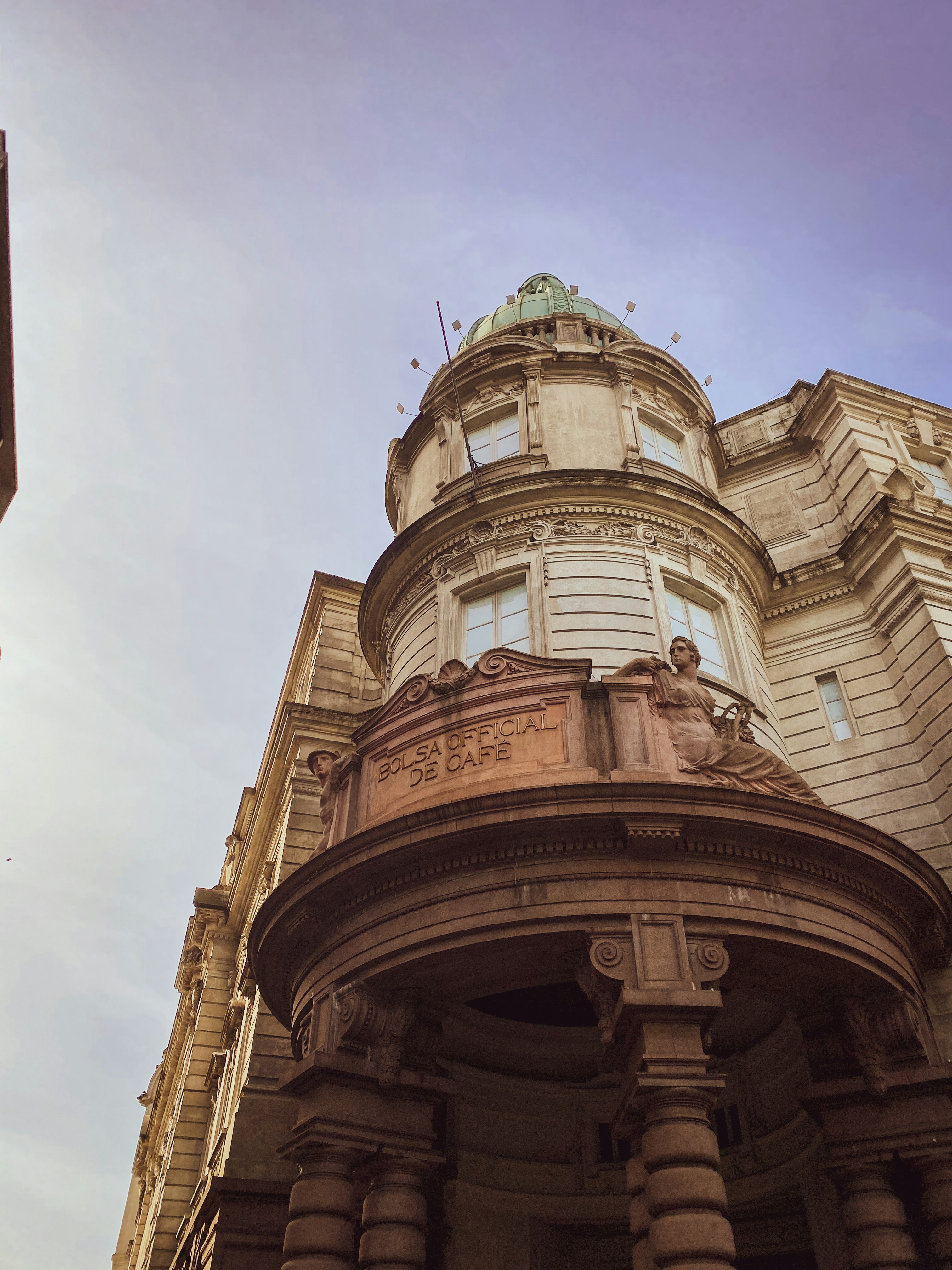 Historic building featuring intricate architectural details and a prominent dome, showcasing the Bolsa Oficial de Café's grandeur.